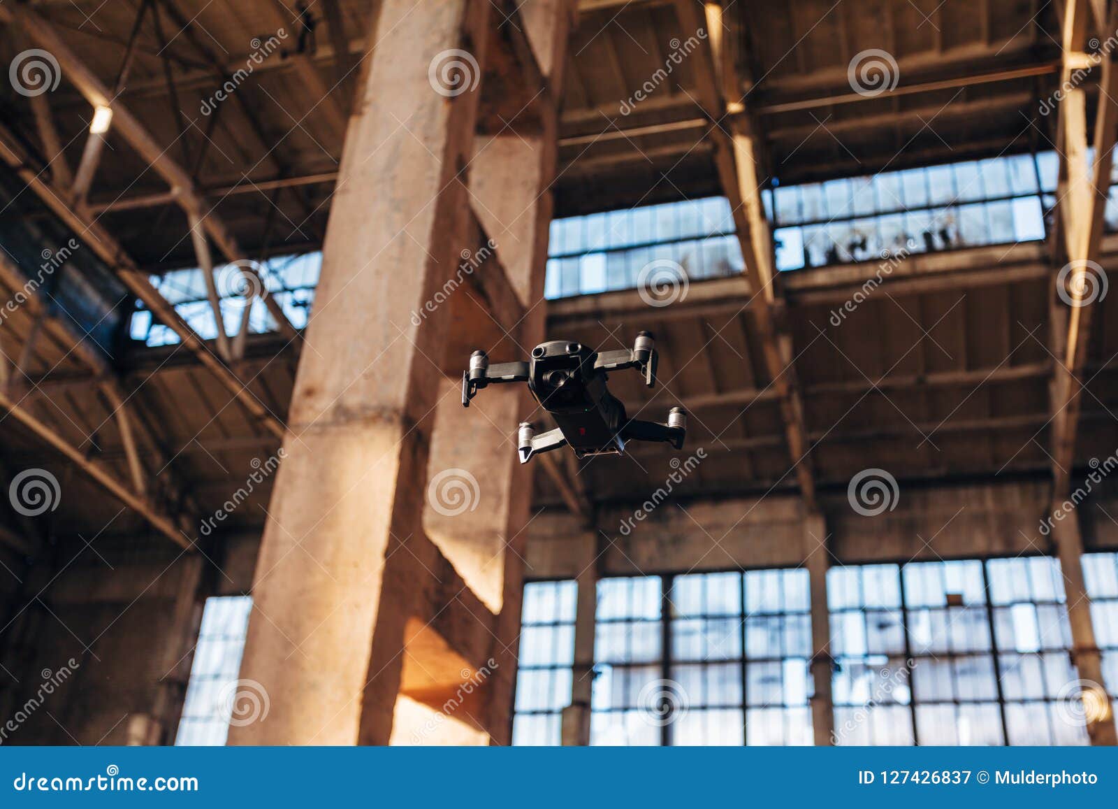 Quad-copter Drone with Camera Flying Inside Industrial Building Stock ...