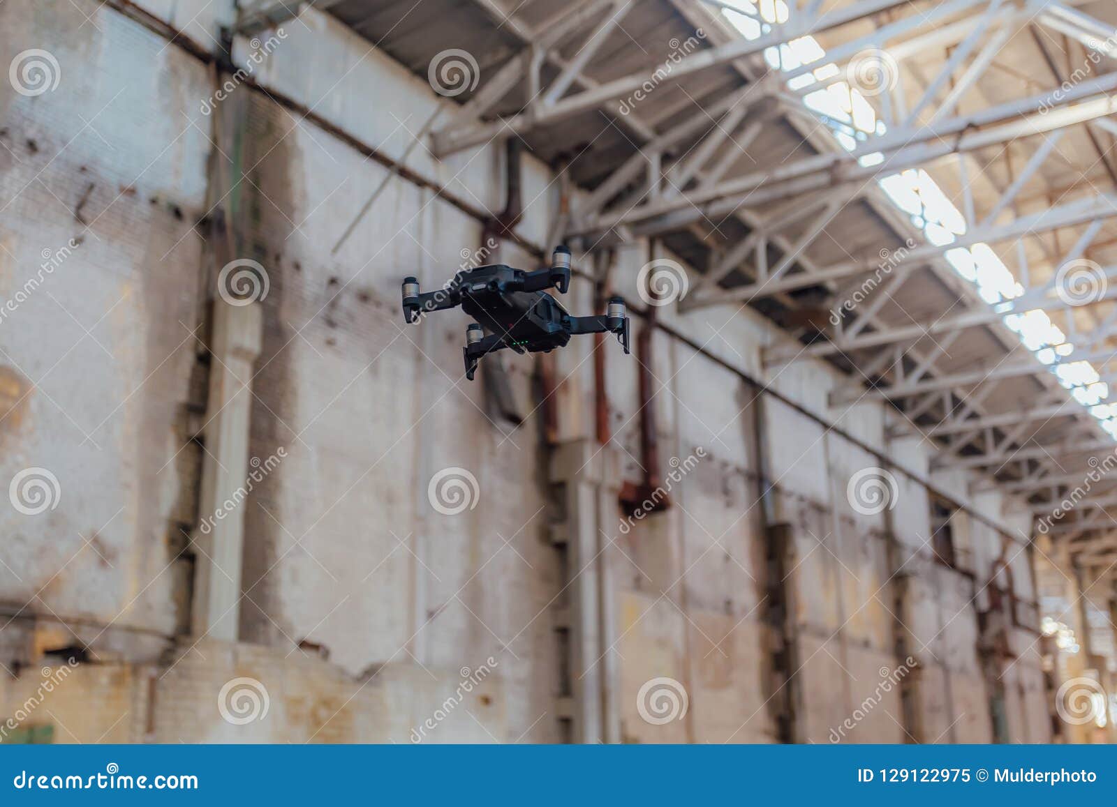 Quad-copter Drone with Camera Flying Inside Industrial Building Stock ...