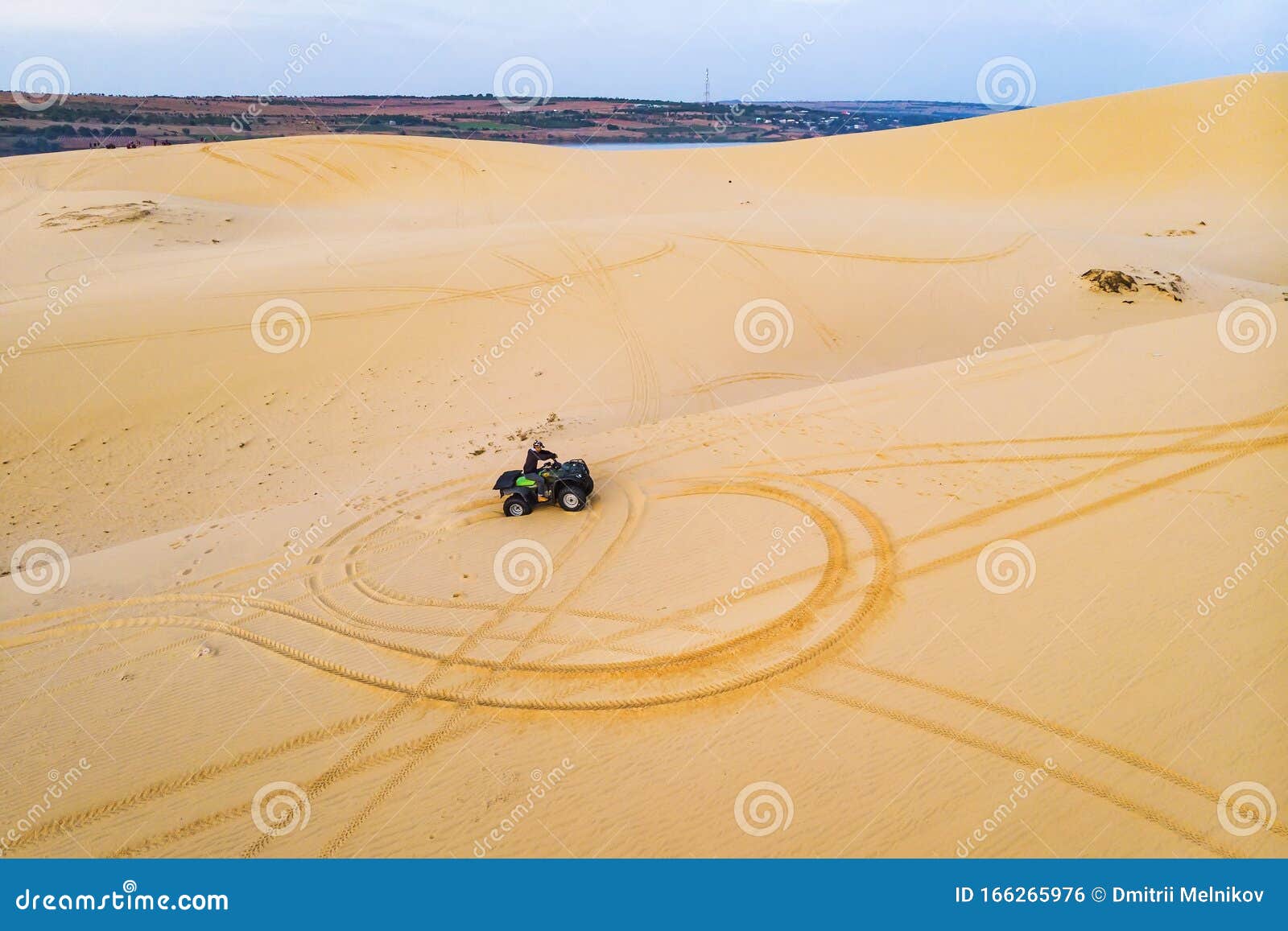 Quad Driving In Sand Desert. ATV Standing In Middle Of Nowhere In Sand ...
