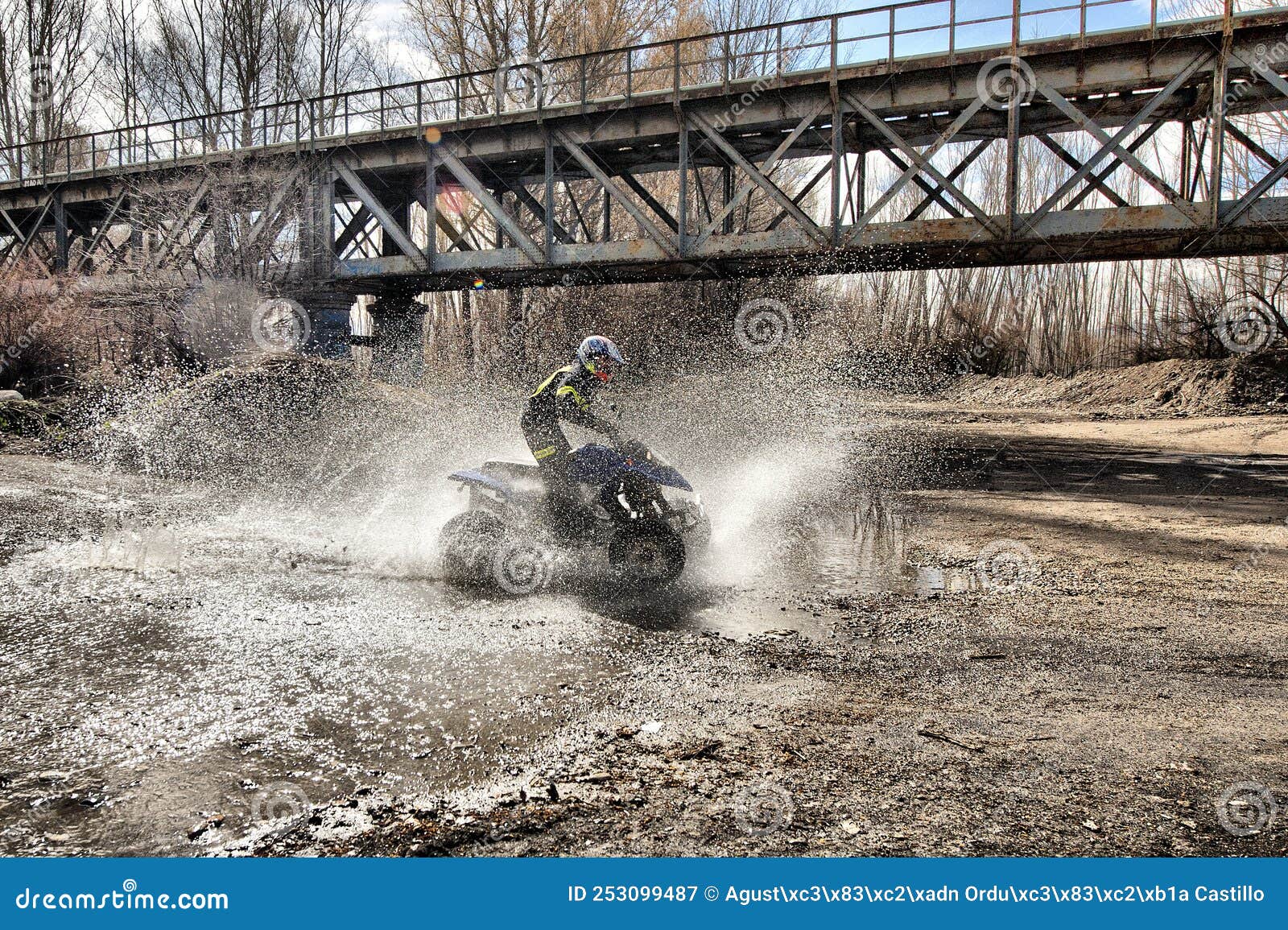 Quad Ride Along the River with a Splash of Water. Stock Image - Image ...
