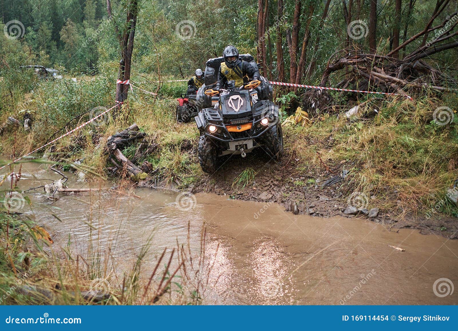 Quad Rider Jumping on a Muddy Forest Trail Editorial Stock Image ...