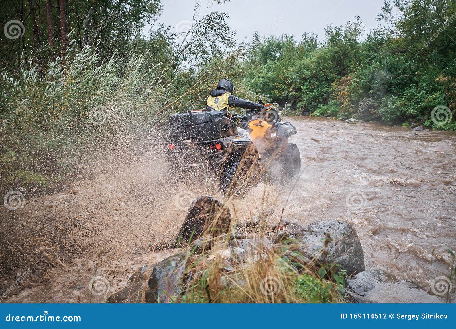 Quad Rider Jumping on a Muddy Forest Trail Editorial Photography ...