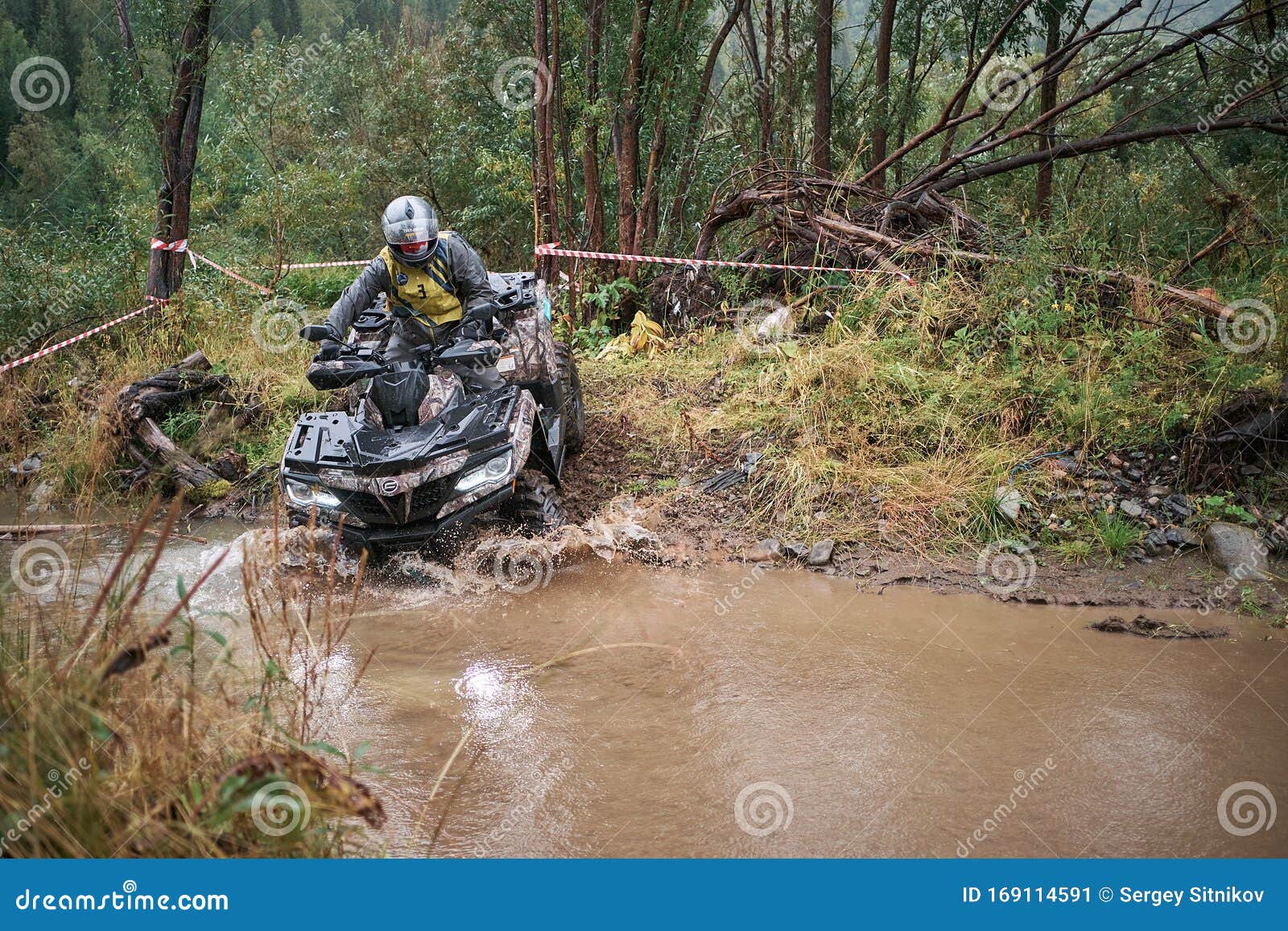 Quad Rider Jumping on a Muddy Forest Trail Editorial Photo - Image of ...