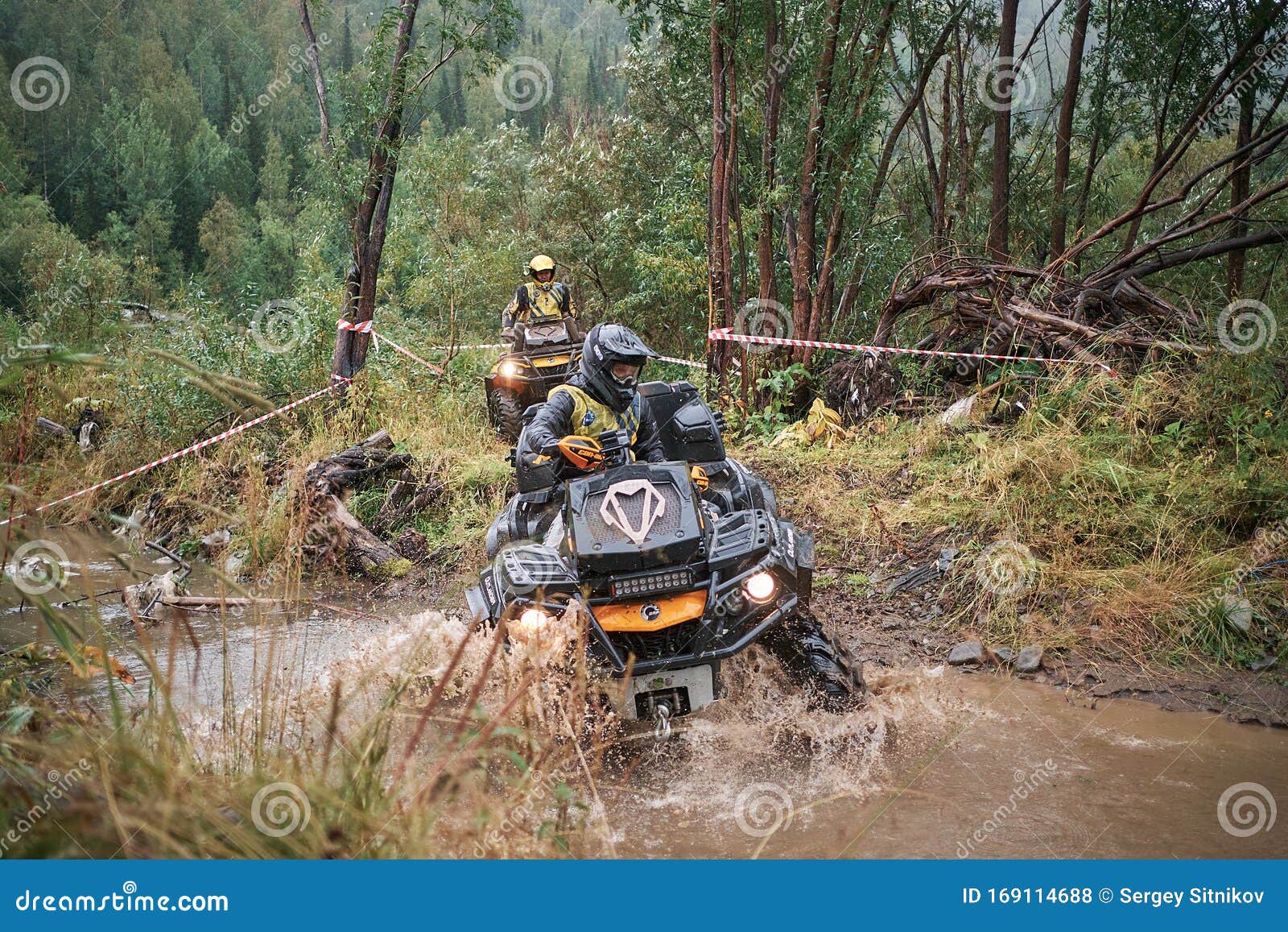 Quad Rider Jumping on a Muddy Forest Trail Editorial Stock Photo ...