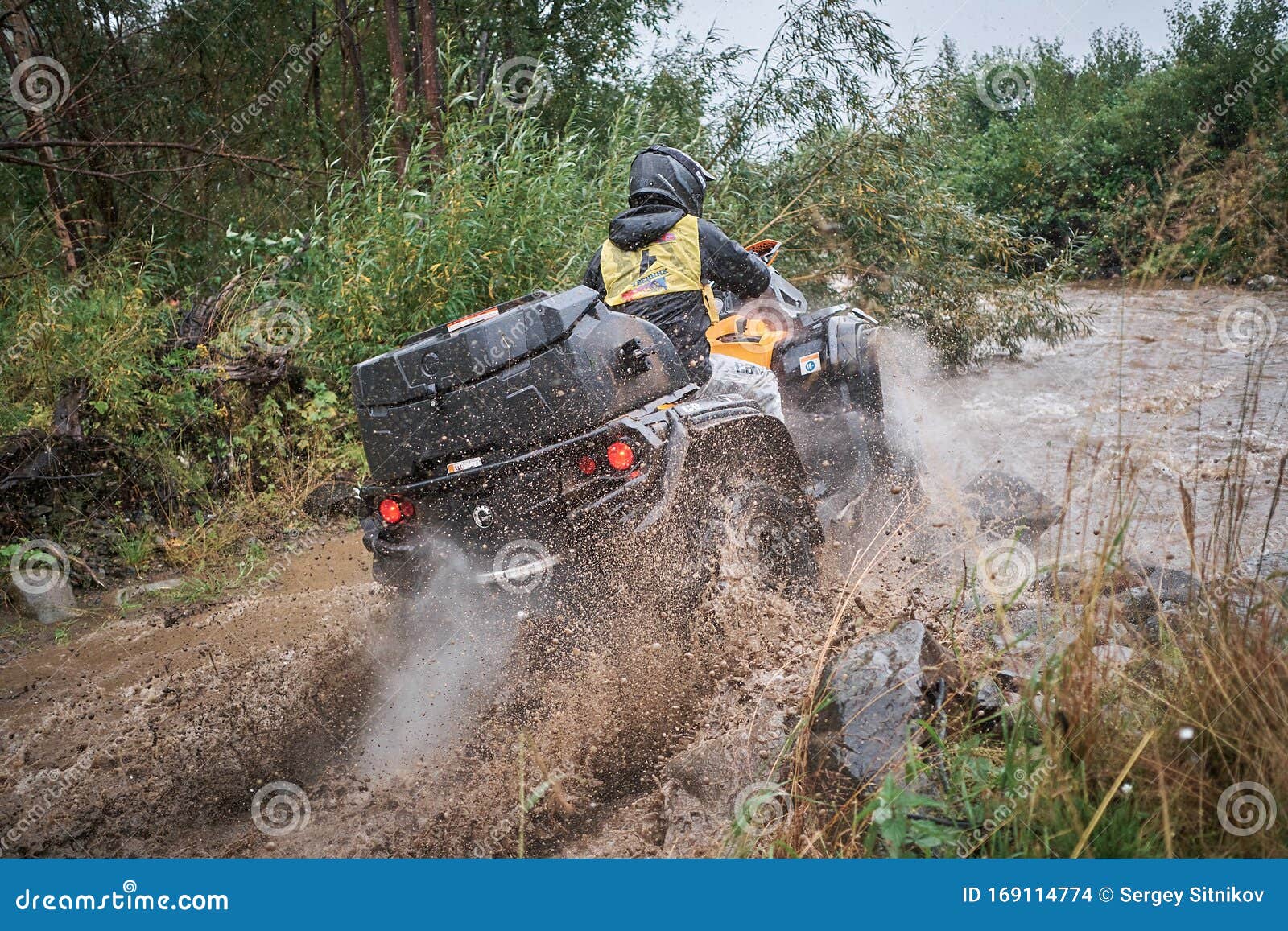 Quad Rider Jumping on a Muddy Forest Trail Editorial Stock Image ...