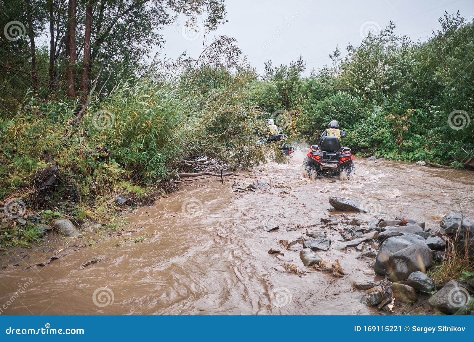 Quad Rider Jumping on a Muddy Forest Trail Editorial Photo - Image of ...