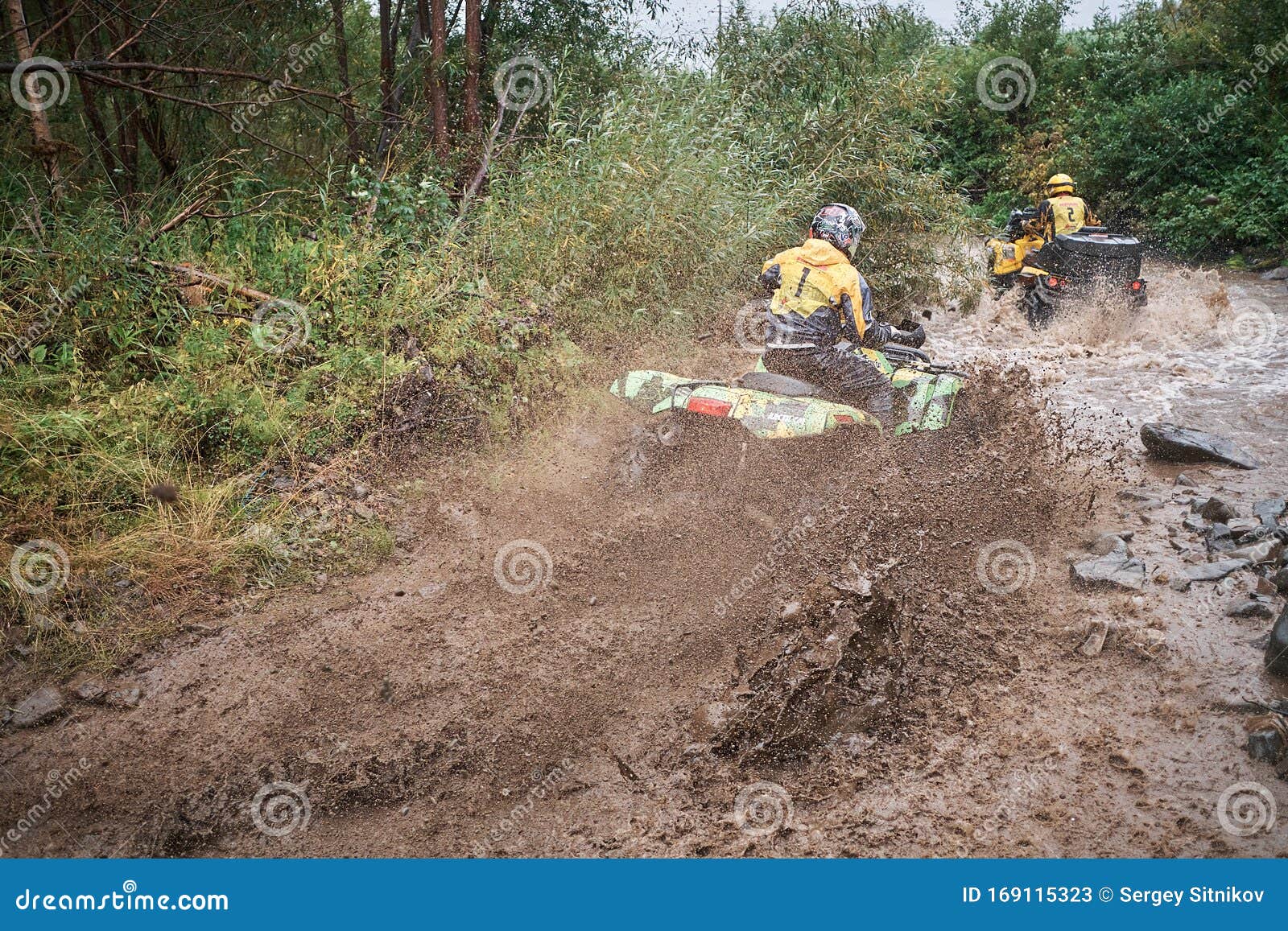 Quad Rider Jumping on a Muddy Forest Trail Editorial Stock Photo ...