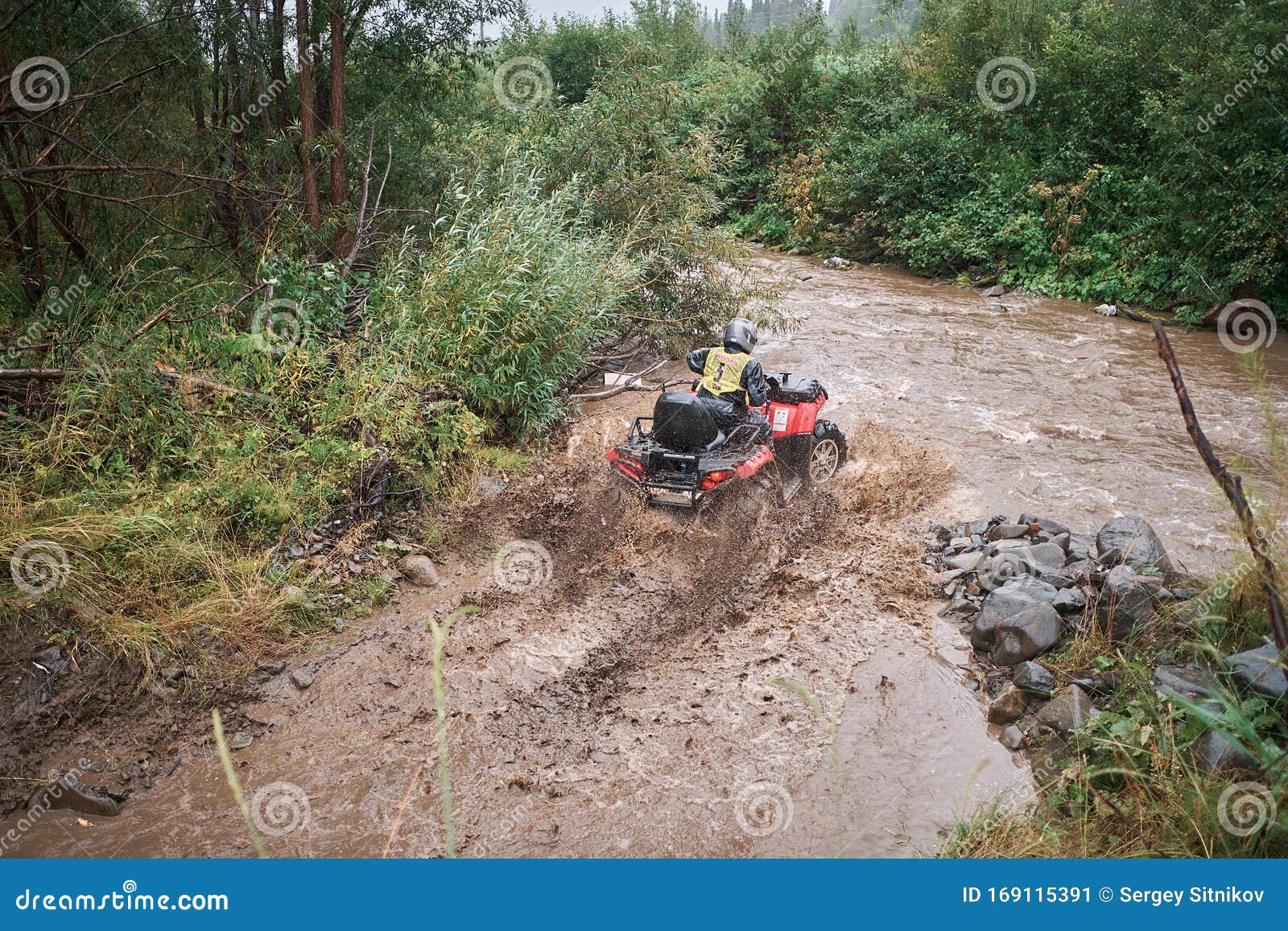 Quad Rider Jumping on a Muddy Forest Trail Editorial Photo - Image of ...