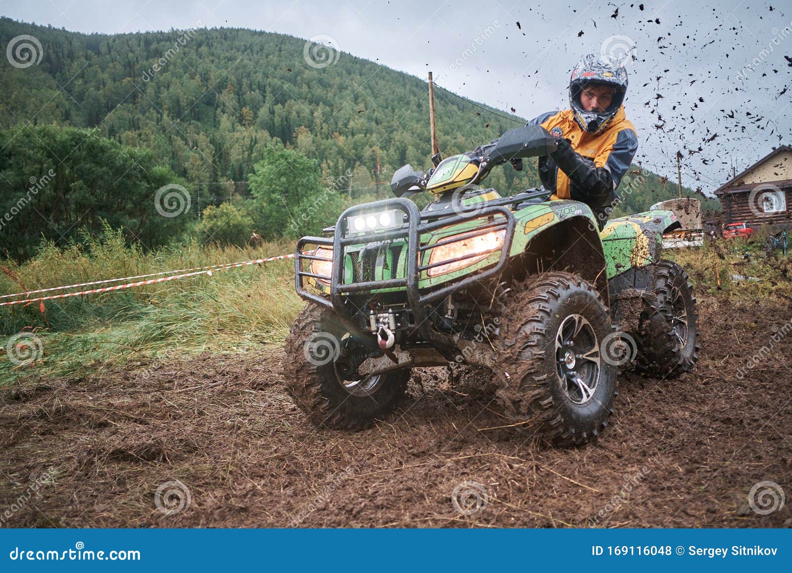 Quad Rider Jumping on a Muddy Forest Trail Editorial Stock Photo ...