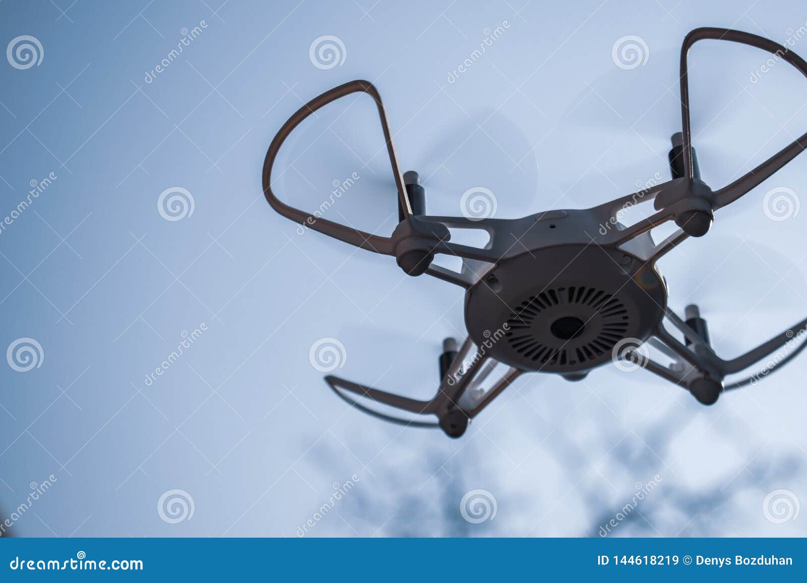Quadcopter Drone Hovering in a Blue Sky Stock Image - Image of delivery ...