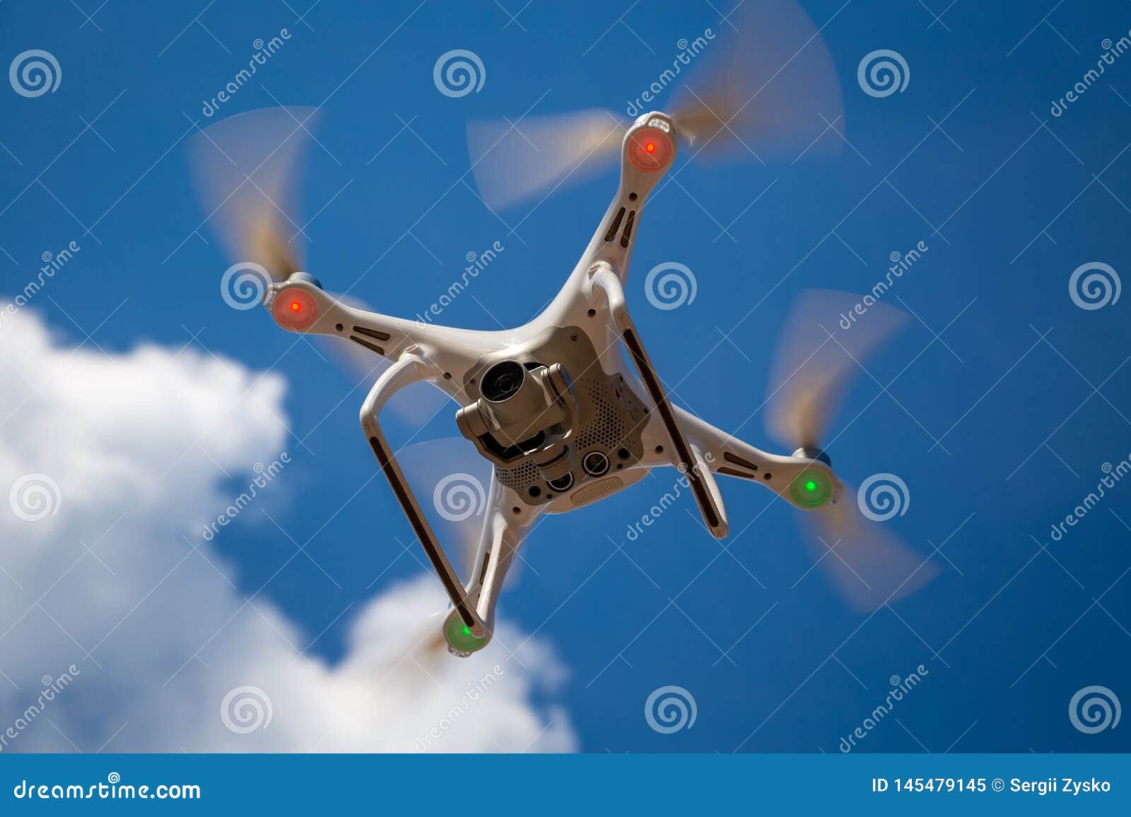 Quadcopter in Flight Against a Blue Sky. Drone Stock Image - Image of ...