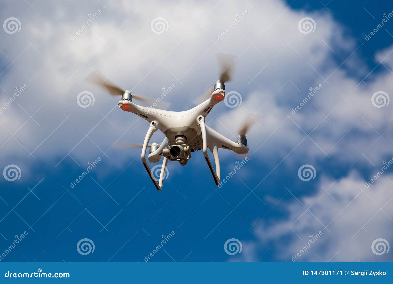 Quadcopter in Flight Against a Blue Sky. Drone Stock Image - Image of ...