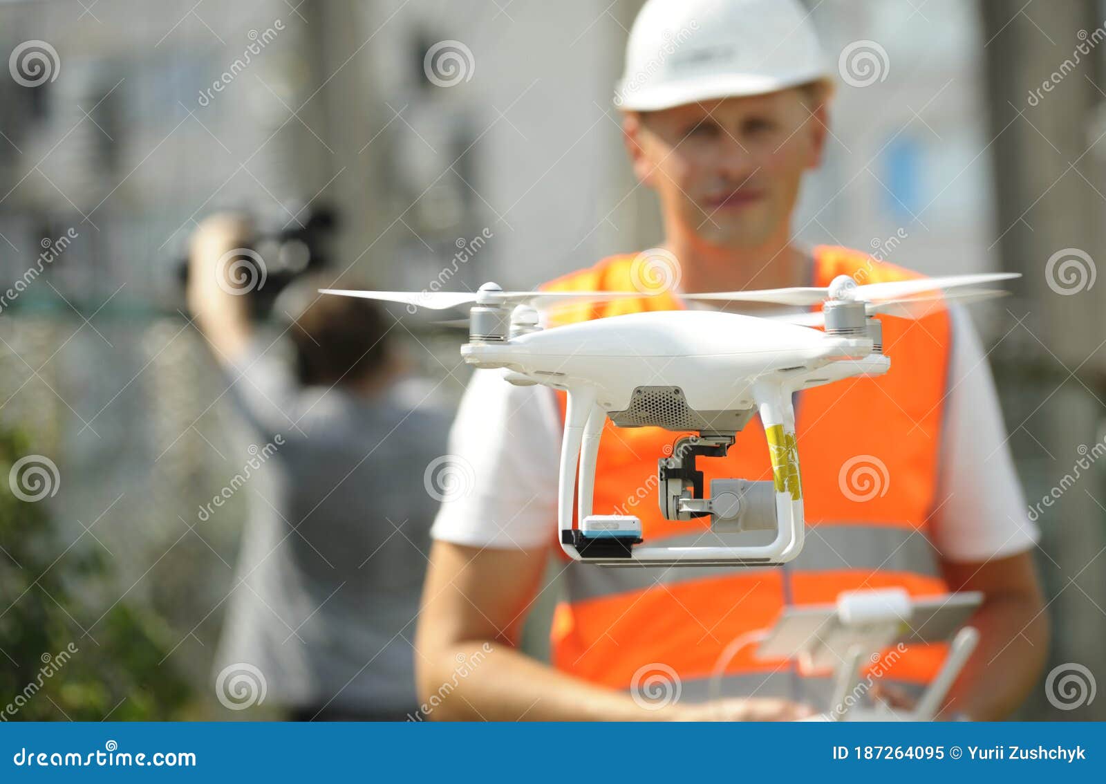 Quadcopter Flying, Operator Controlling it on a Background Editorial ...