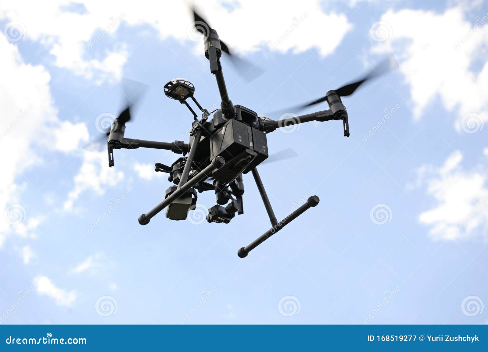 Quadcopter flying in a sky stock image. Image of quadrotor - 168519277