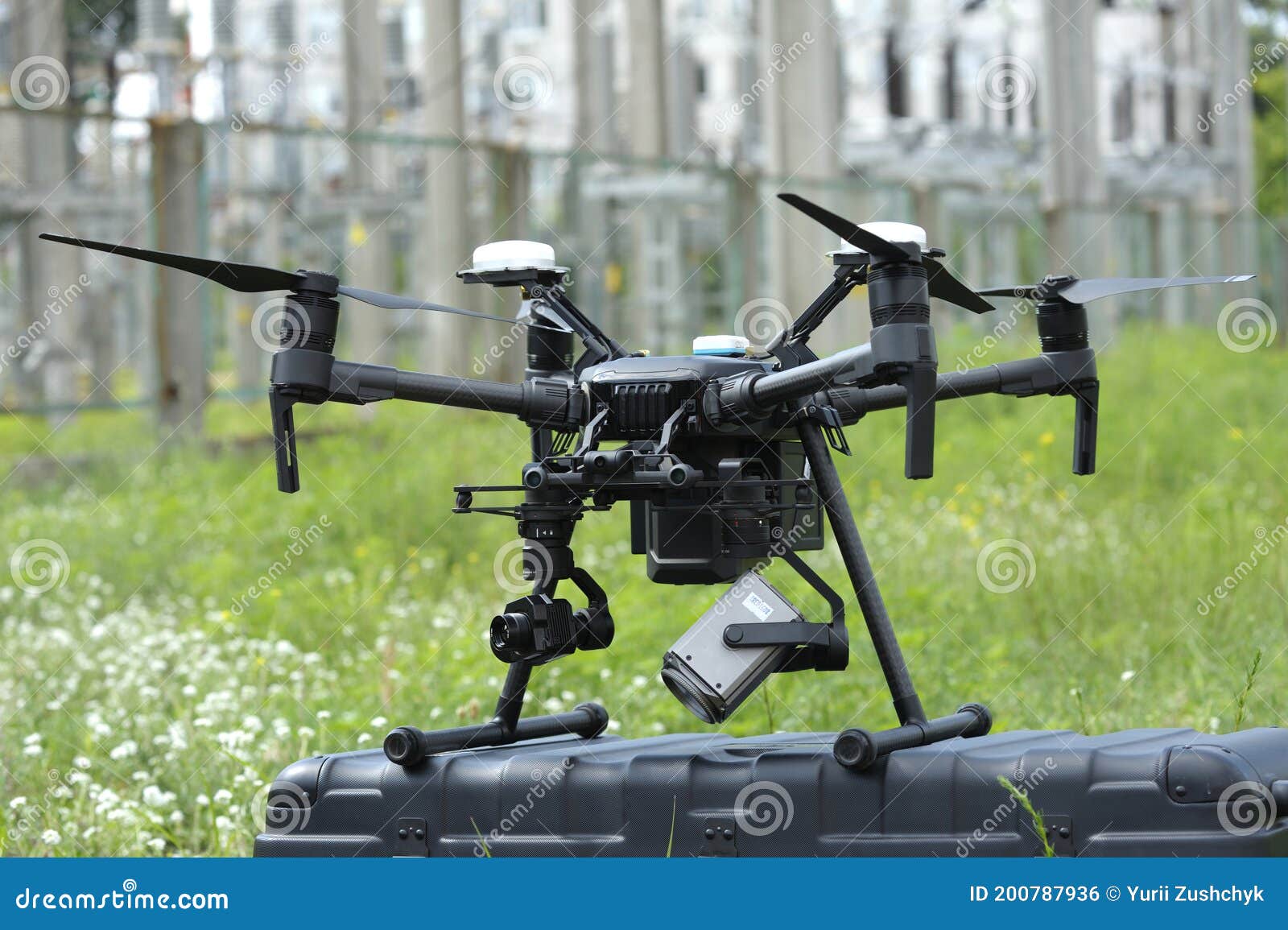Quadcopter Placed on a Box before Launching, Blurred Power Lines on a ...