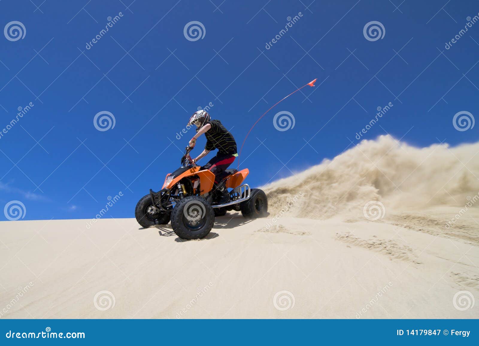 Quadding in sand dunes stock image. Image of blue, lens - 14179847