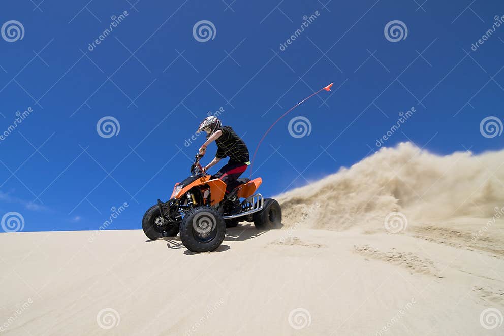 Quadding in sand dunes stock image. Image of blue, lens - 14179847