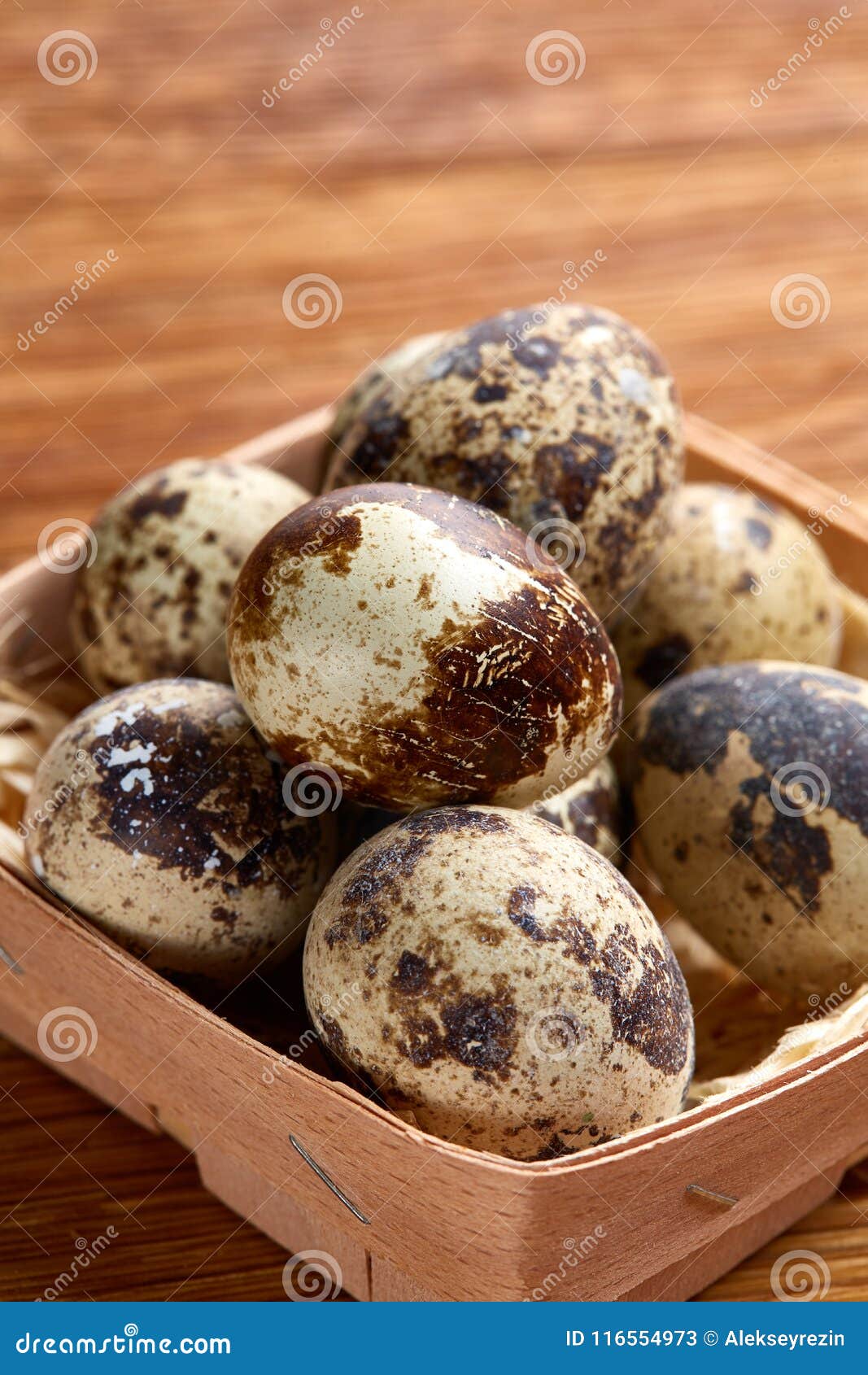 Quail Eggs in a Box on a Rustic Wooden Background, Top View, Selective ...