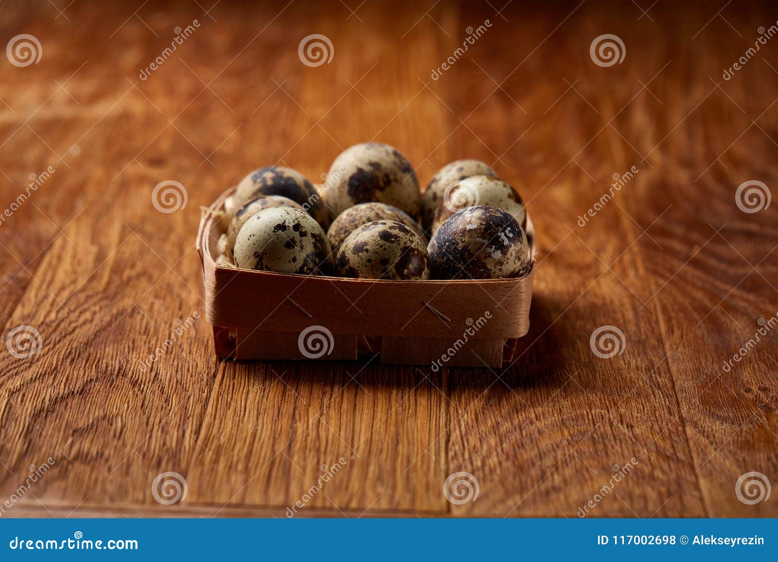 Quail Eggs in a Box on a Rustic Wooden Background, Top View, Selective ...