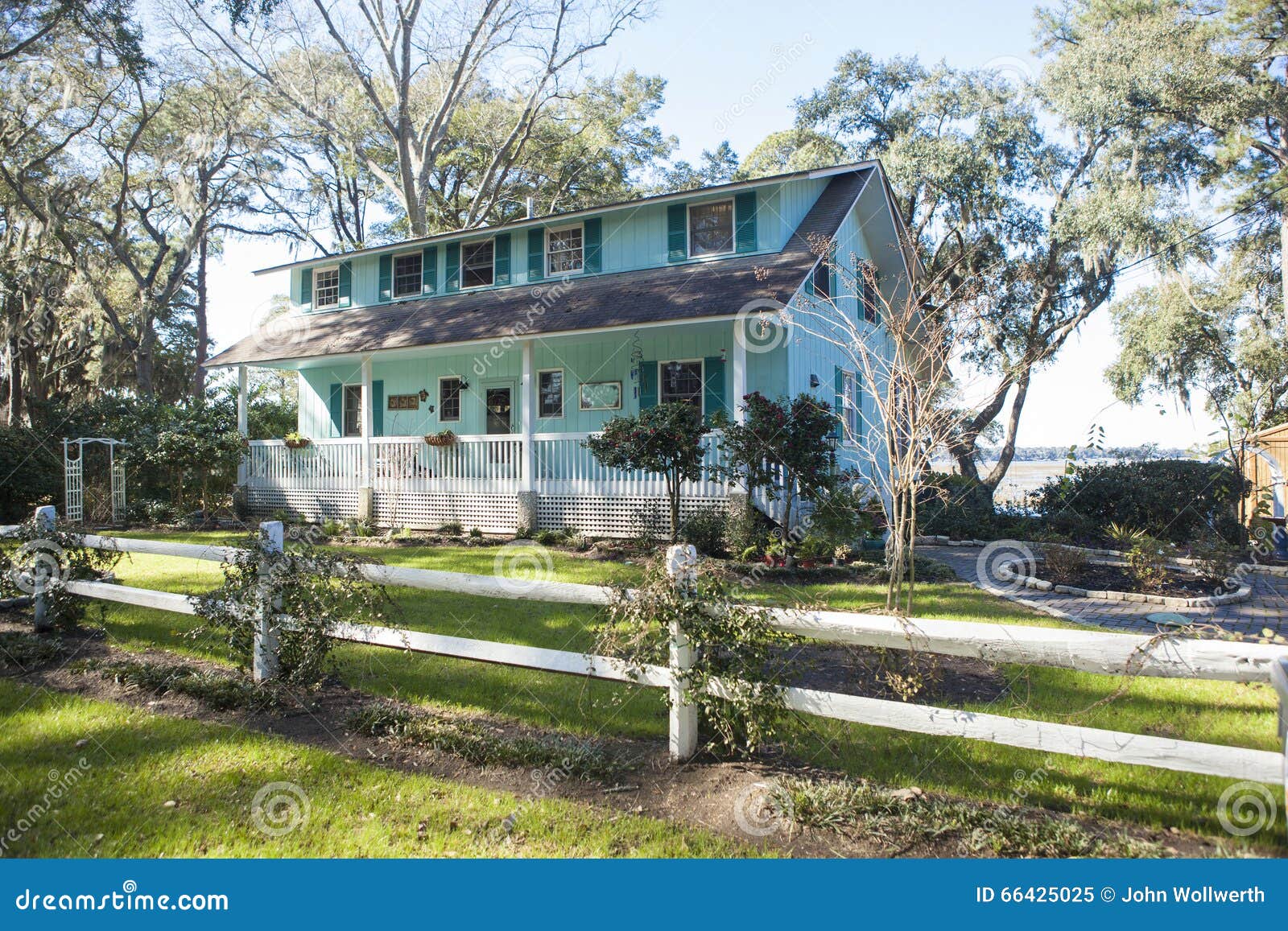 Quaint Home with Nice Landscaping Stock Image - Image of rail, blue ...