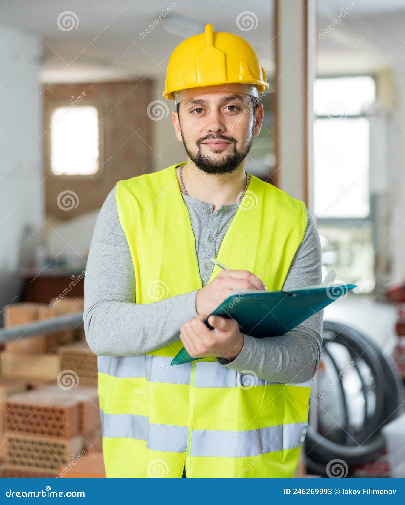 Qualified Builder Writes Notes on a Tablet Stock Image - Image of ...