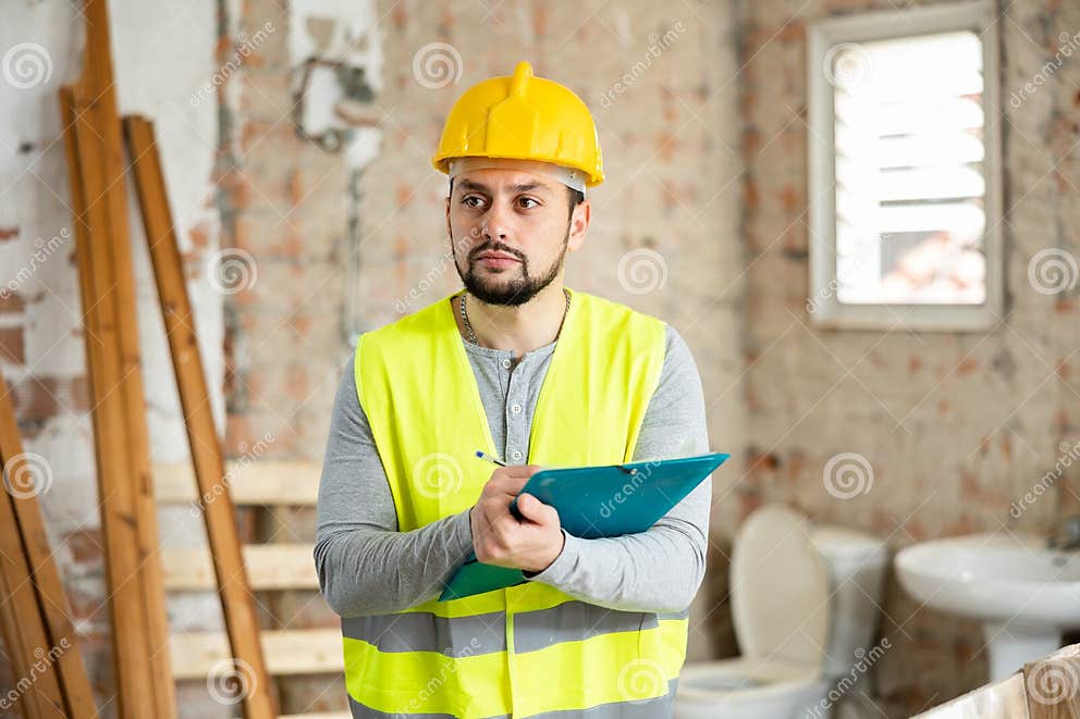 Qualified Builder Writes Notes on a Tablet Stock Photo - Image of ...