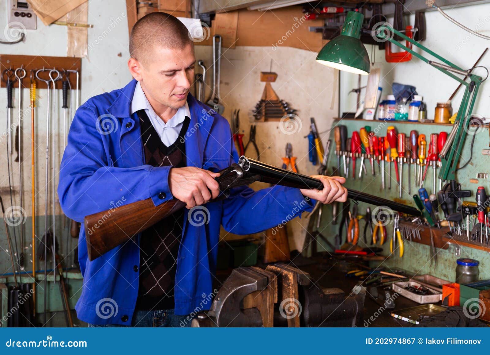 Gunsmith Working On An 300 Blackout AR Rifle Upper Receiver In A ...