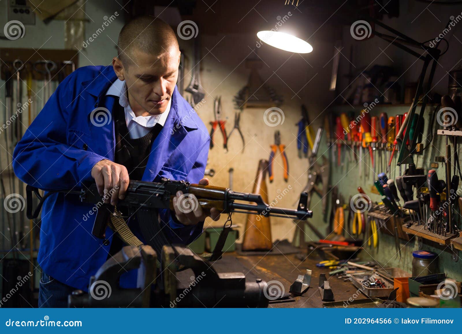 Gunsmith Performing Maintenance of Kalashnikov Assault Rifle in ...