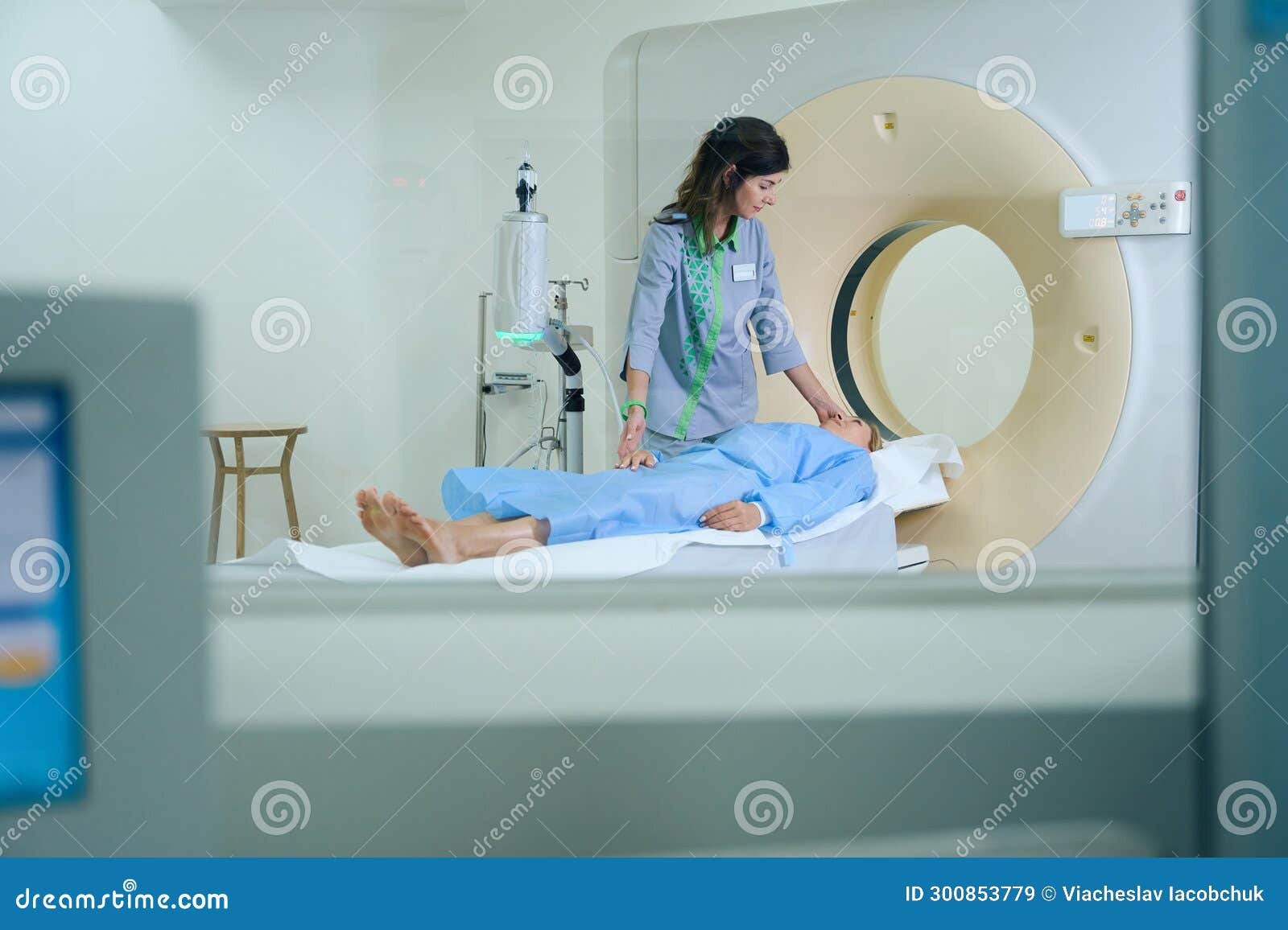 Qualified Radiographer is Getting Patient Ready for Computed Tomography ...