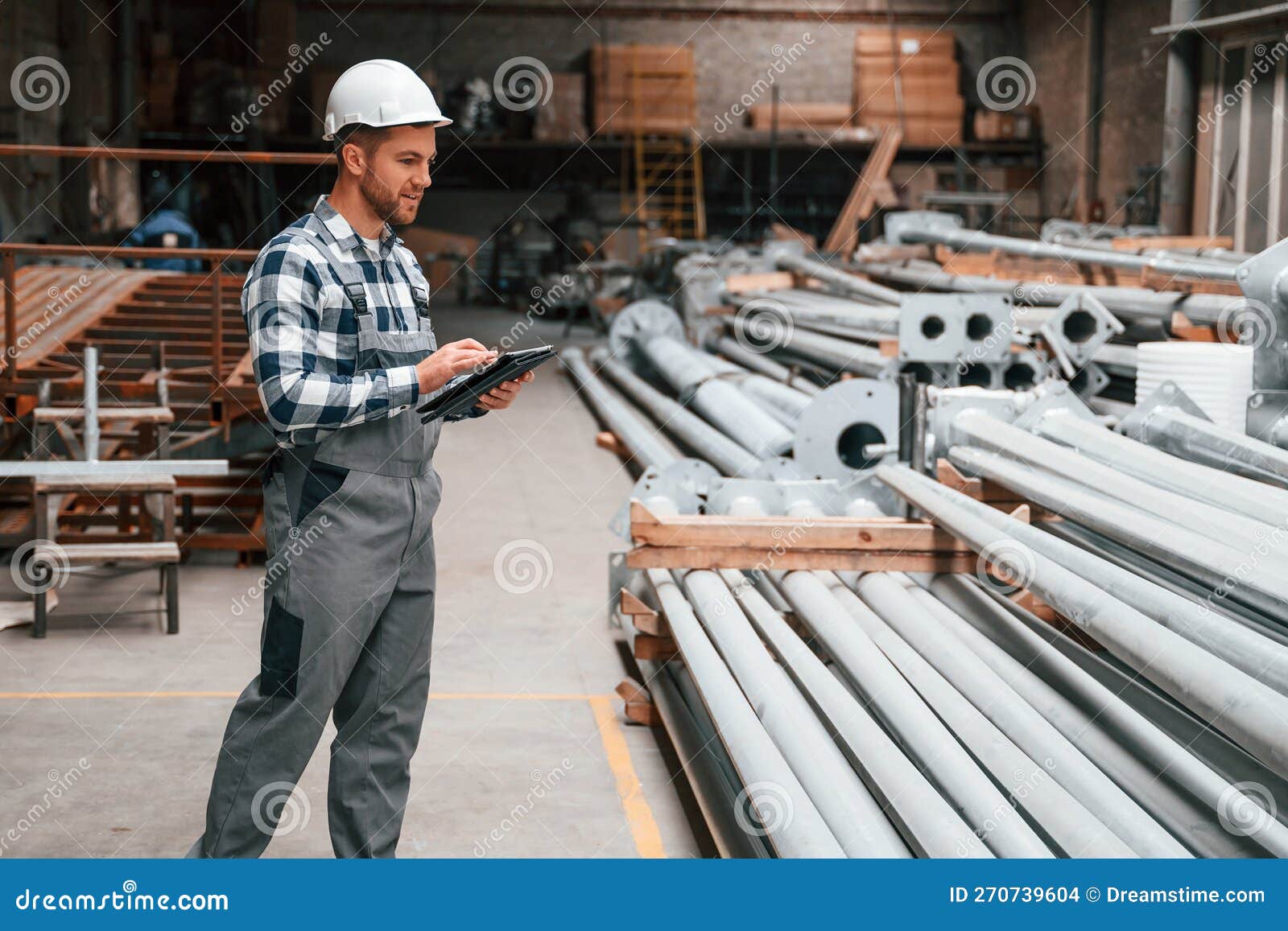 Quality Control. Factory Male Worker in Uniform is Indoors Stock Photo ...