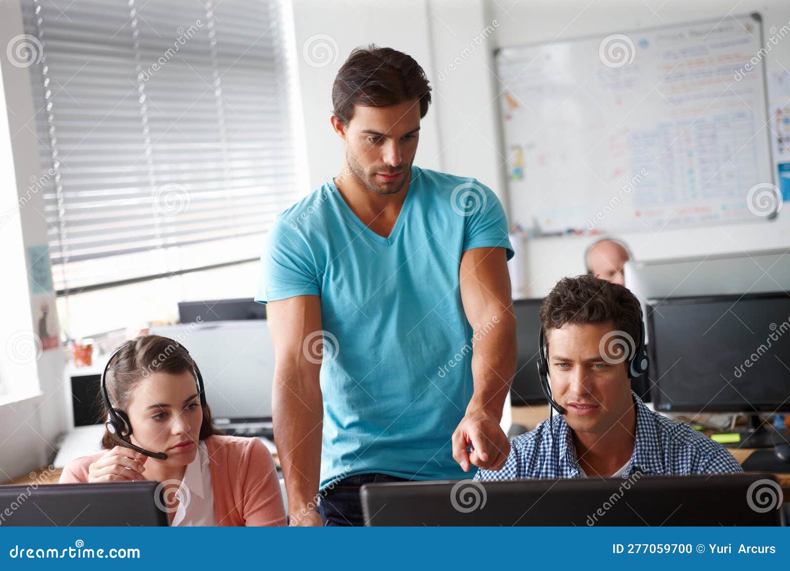 Quality Control. a Handsome Man Standing and Pointing at a Computer ...