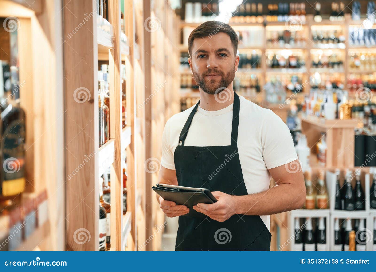 Quality Control, with Notepad. Wine Shop Owner in White Shirt and Black ...