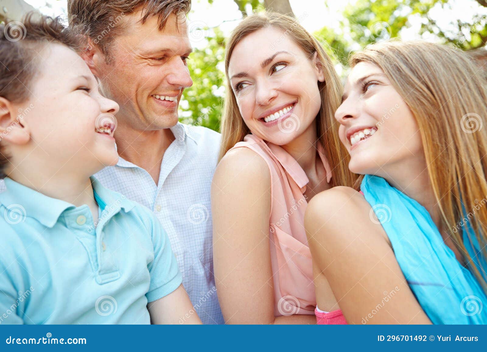 Quality Family Time in the Park. Happy Family Smiling while Outdoors ...