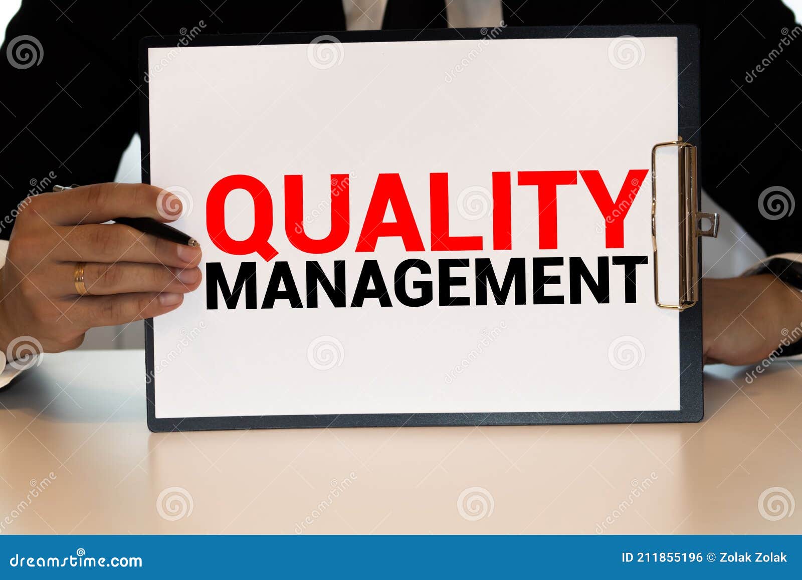 Quality Management Marked on Rubber Stamp Stock Photo - Image of plan ...