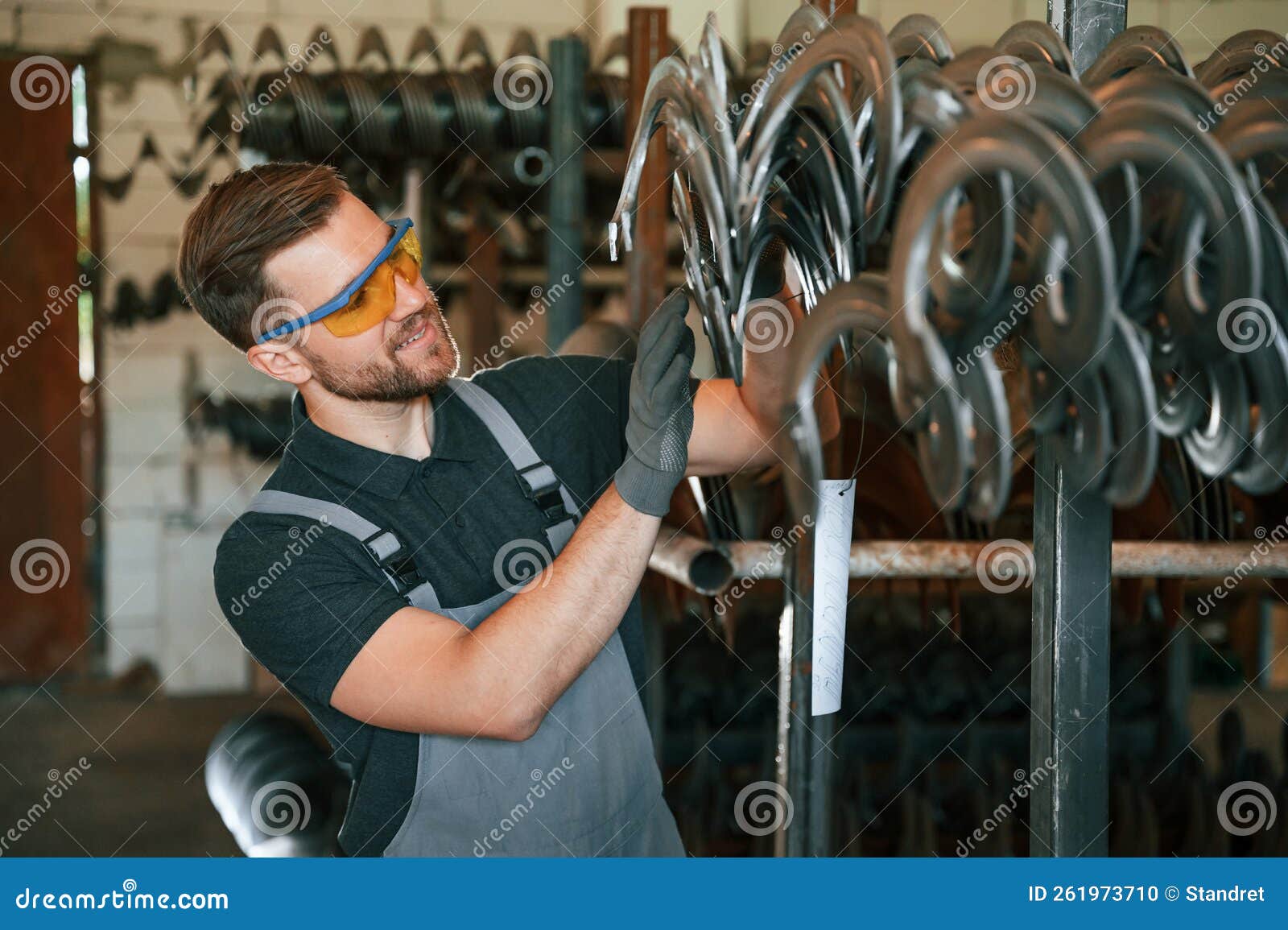 Quality Test. Man in Uniform is in Workstation Developing Details of ...