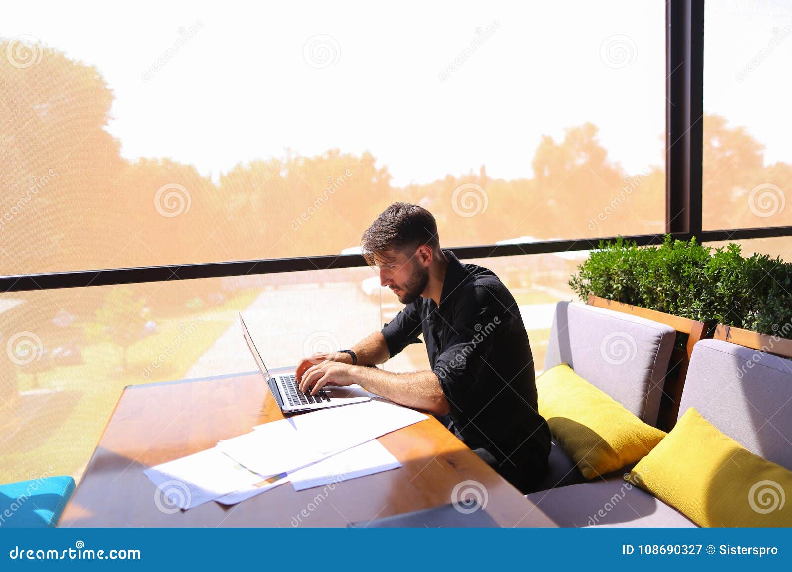 Quantity Surveyor Working at Cafe Table with Papers and Laptop. Stock ...