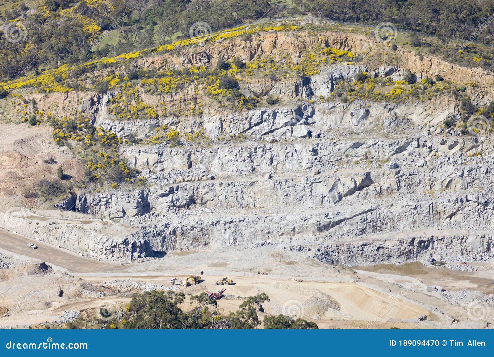 Quarry Digging Opening into the Side of a Mountain with Machinery at ...