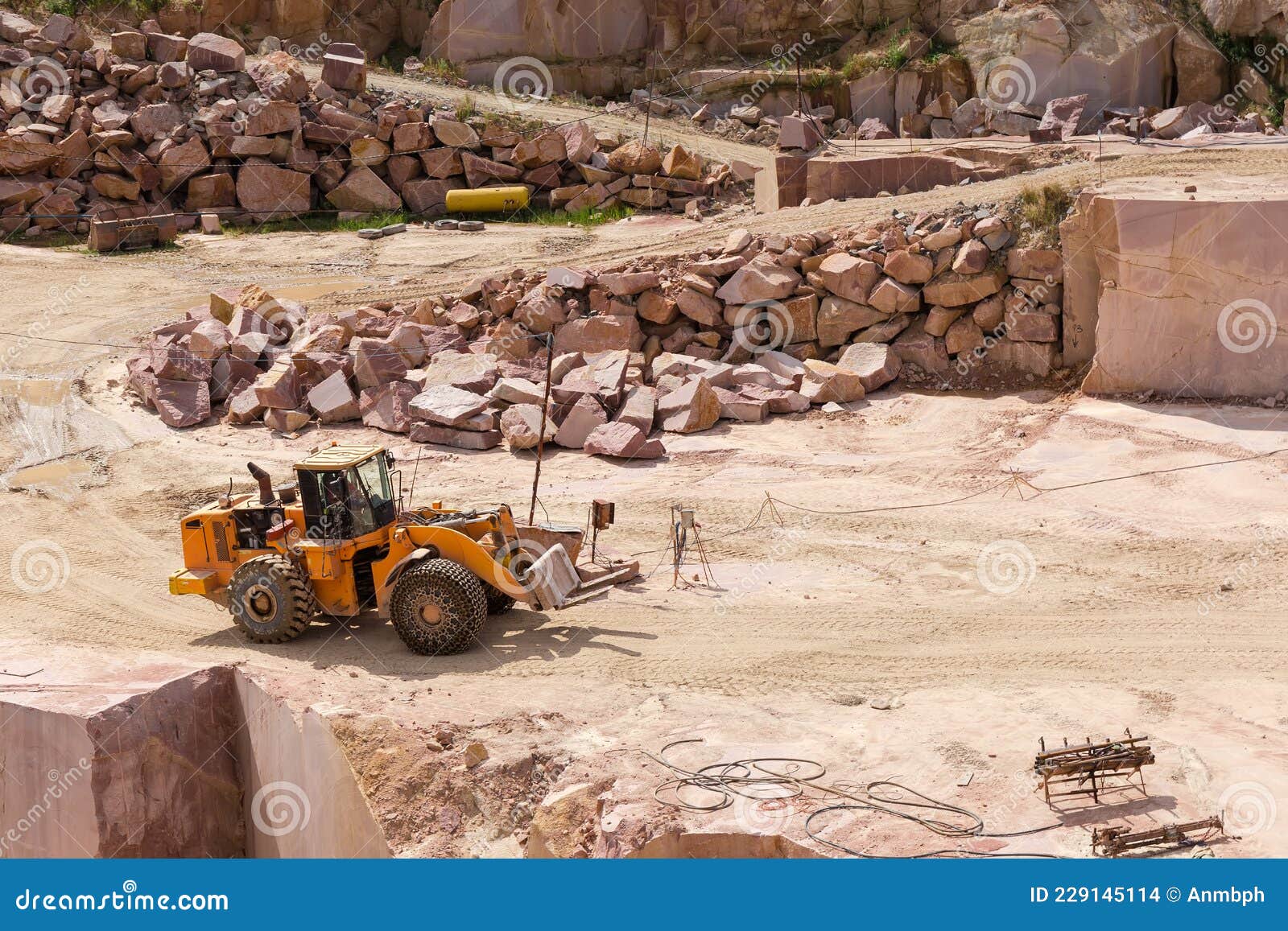 Quarry Forklift Loader in Operating Quarry of Red Granite Stock Photo ...