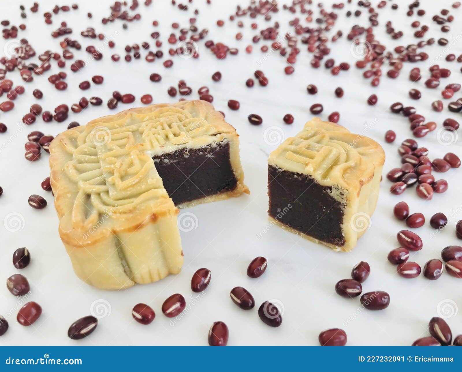 A Quarter-cut Mooncake on White Marble Background with Red Beans. Stock ...