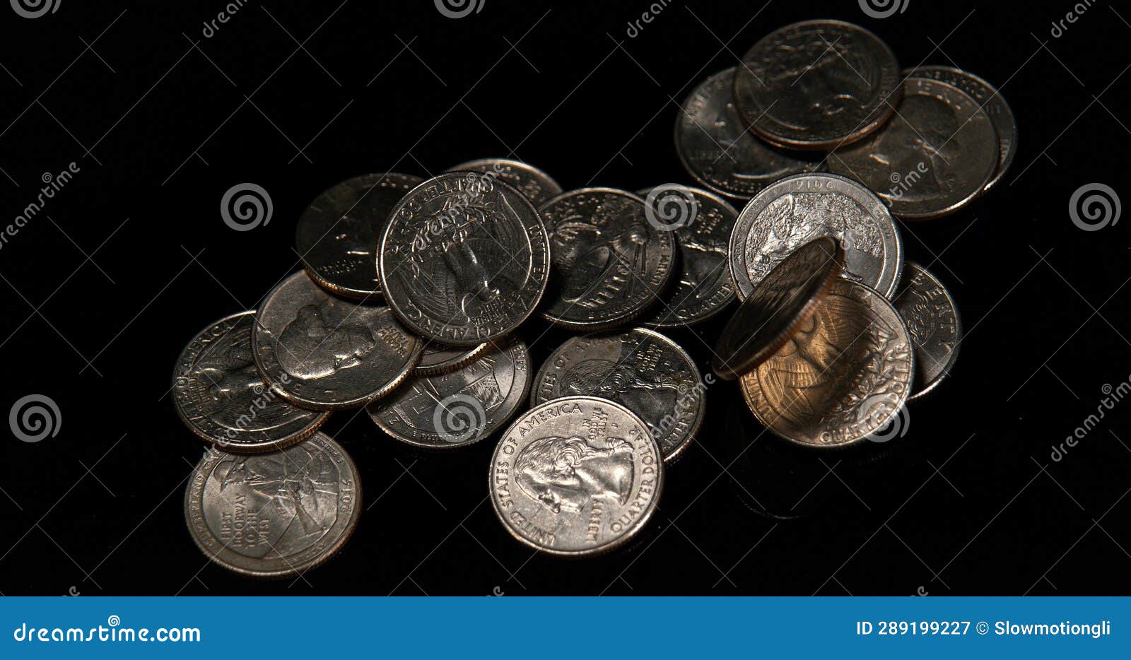 Quarter Dollar Coins Falling, Rolling and Sliding on Black Background ...