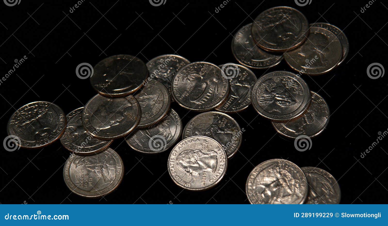 Quarter Dollar Coins Falling, Rolling and Sliding on Black Background ...