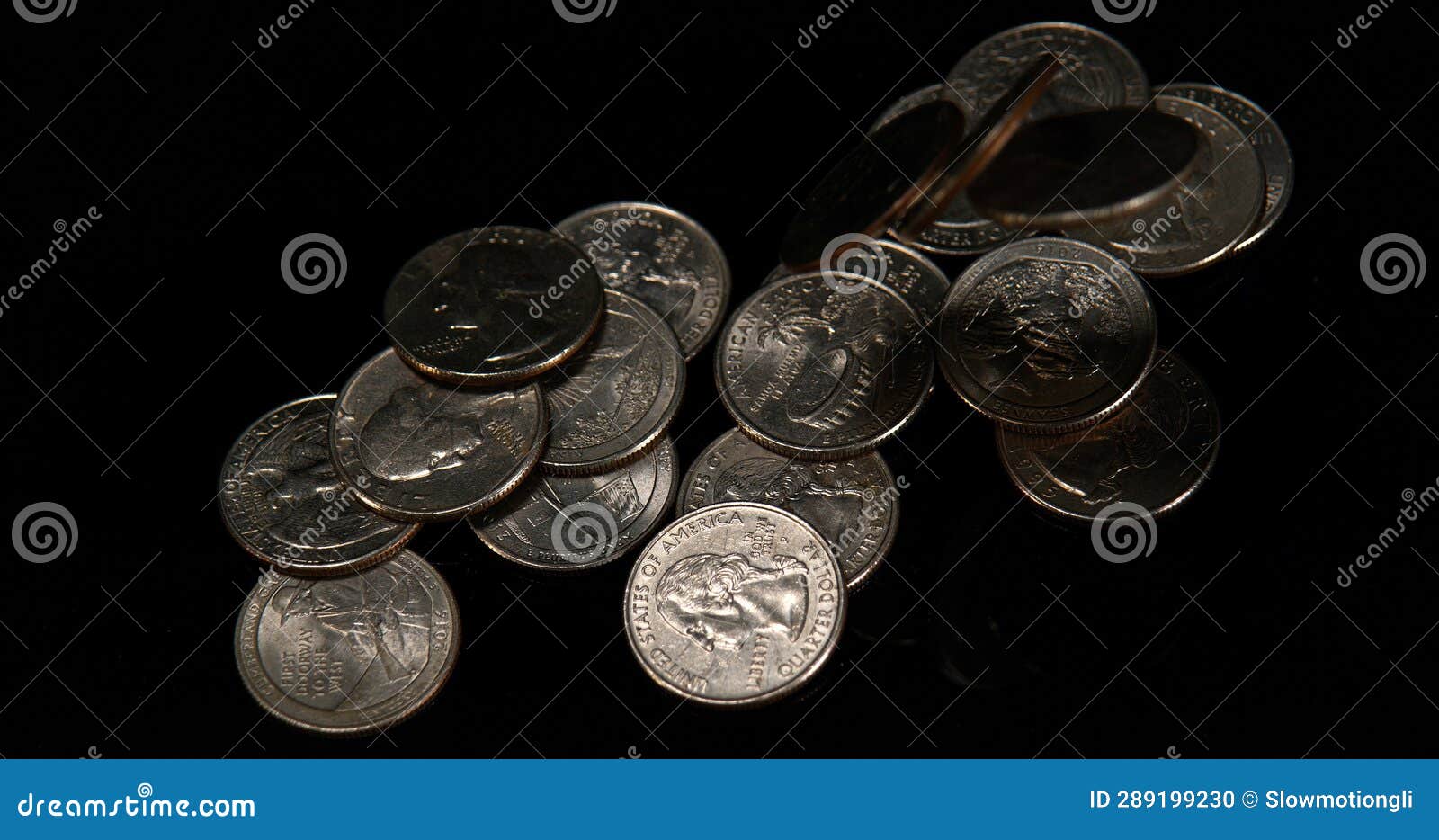 Quarter Dollar Coins Falling, Rolling and Sliding on Black Background ...