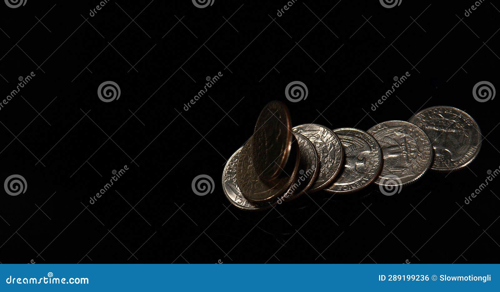 Quarter Dollar Coins Falling, Rolling and Sliding on Black Background ...