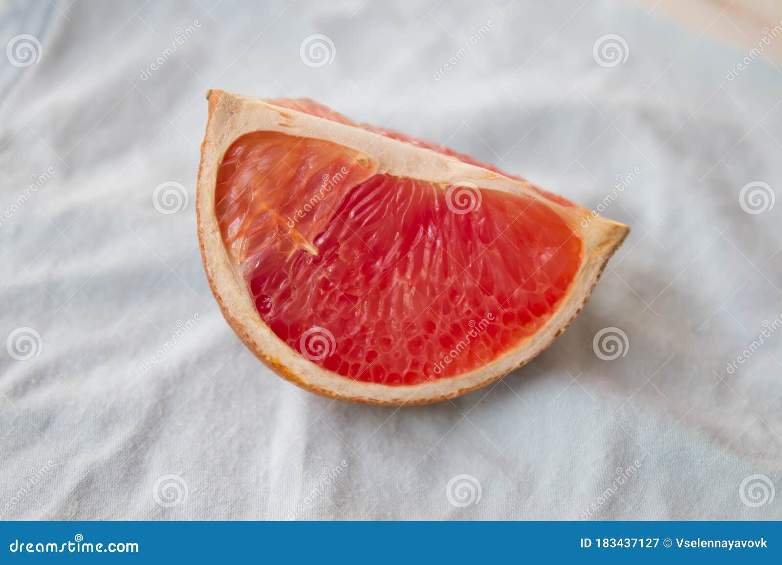 Quarters Flat Layout of Grapefruit Slices on Marble and Blue Loaf Close ...