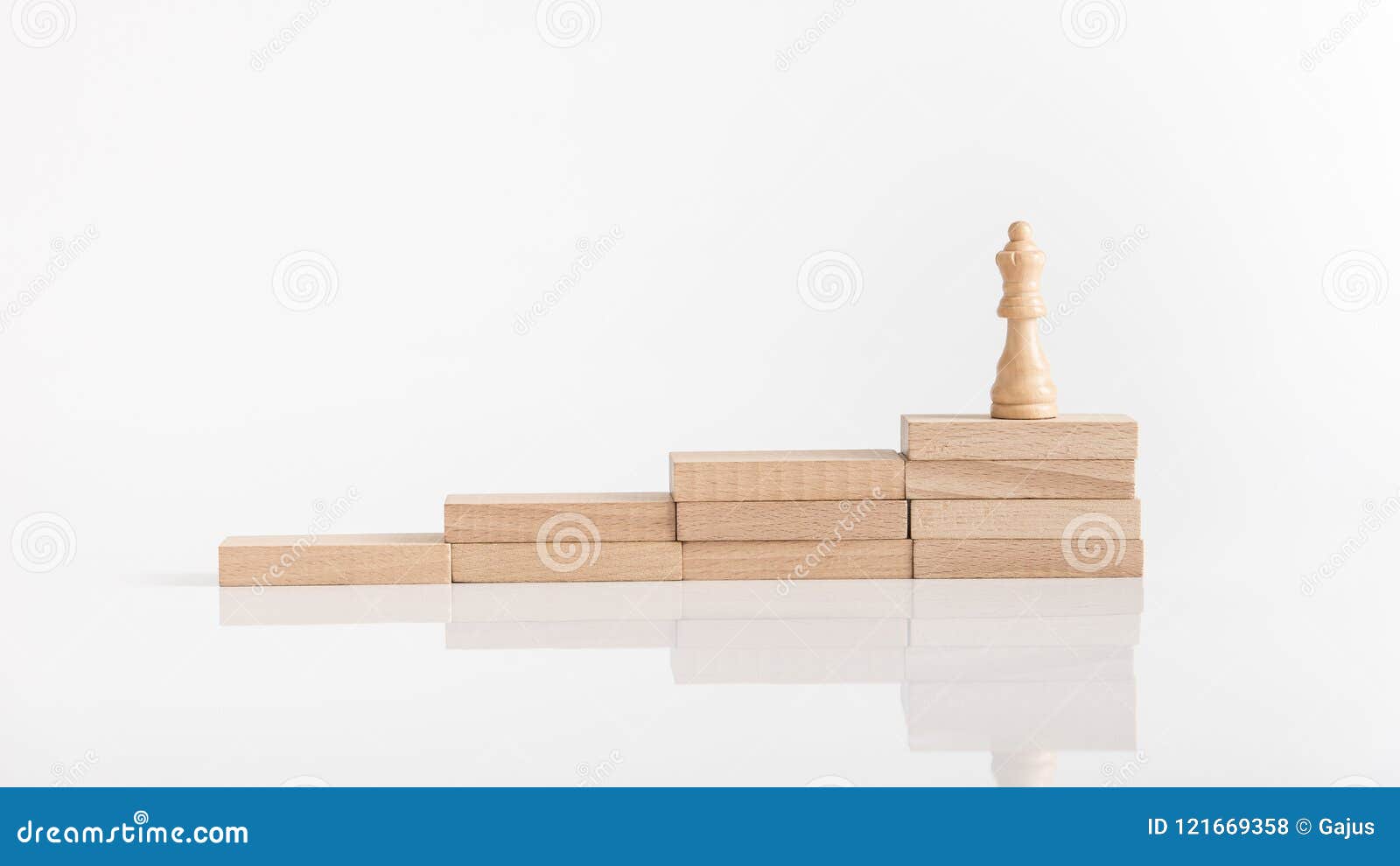 Queen Chess Piece on a Stepped Stack of Wood Blocks Stock Photo - Image ...
