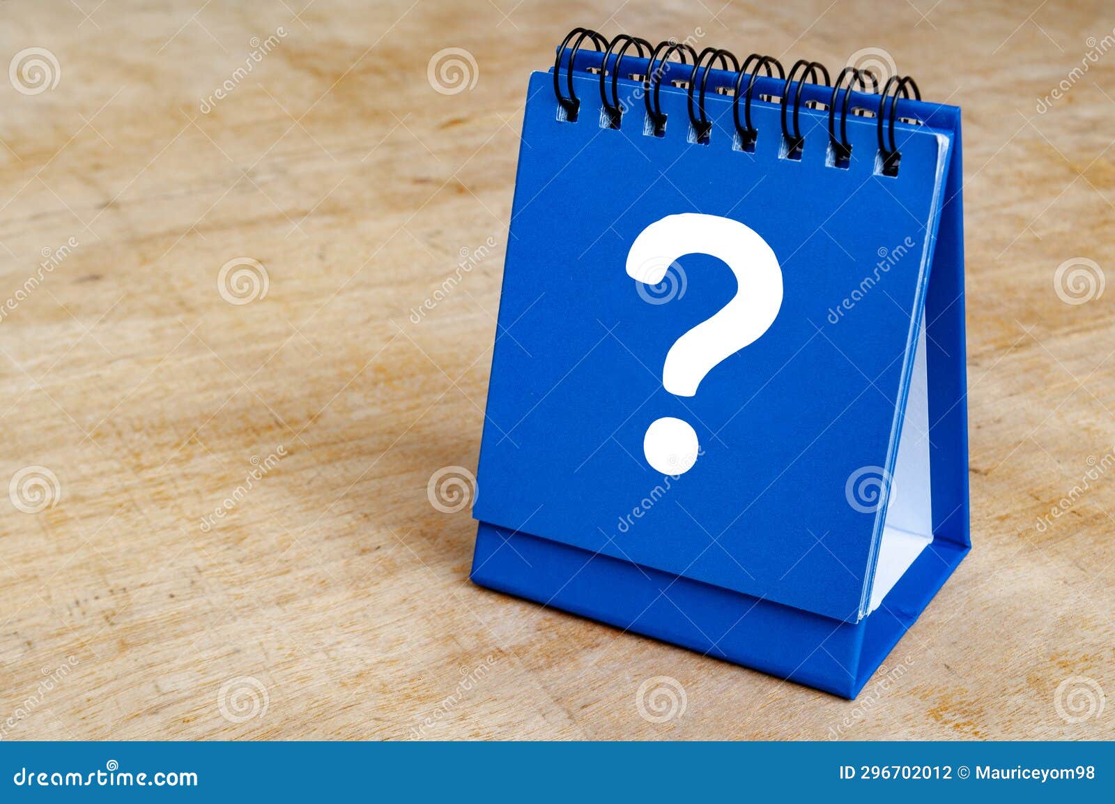 Question Mark on Blue Notepad on Wooden Background. Question and Answer ...