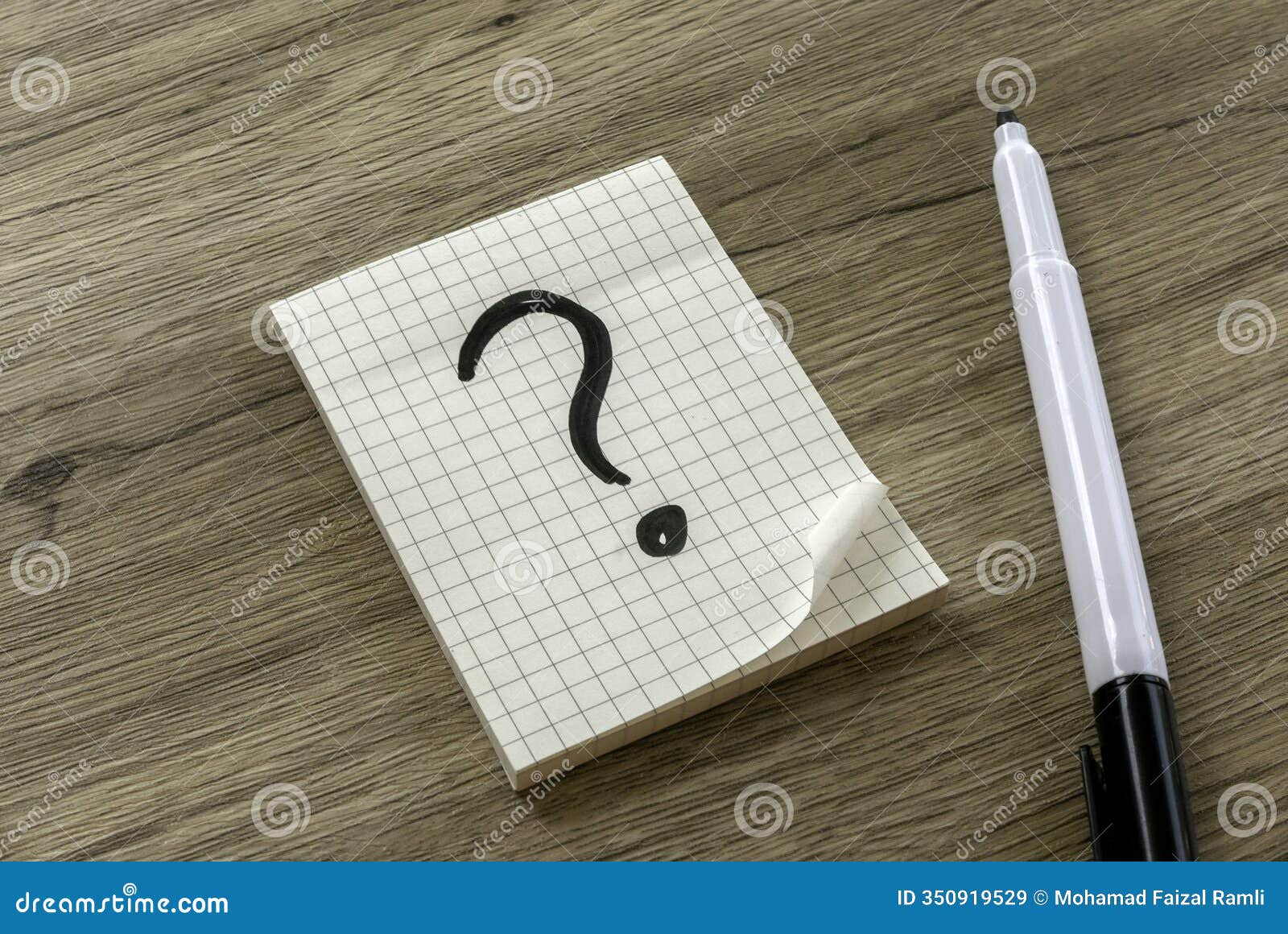 Question Mark on Graph Paper Notepad and Pen on Wooden Surface Stock ...