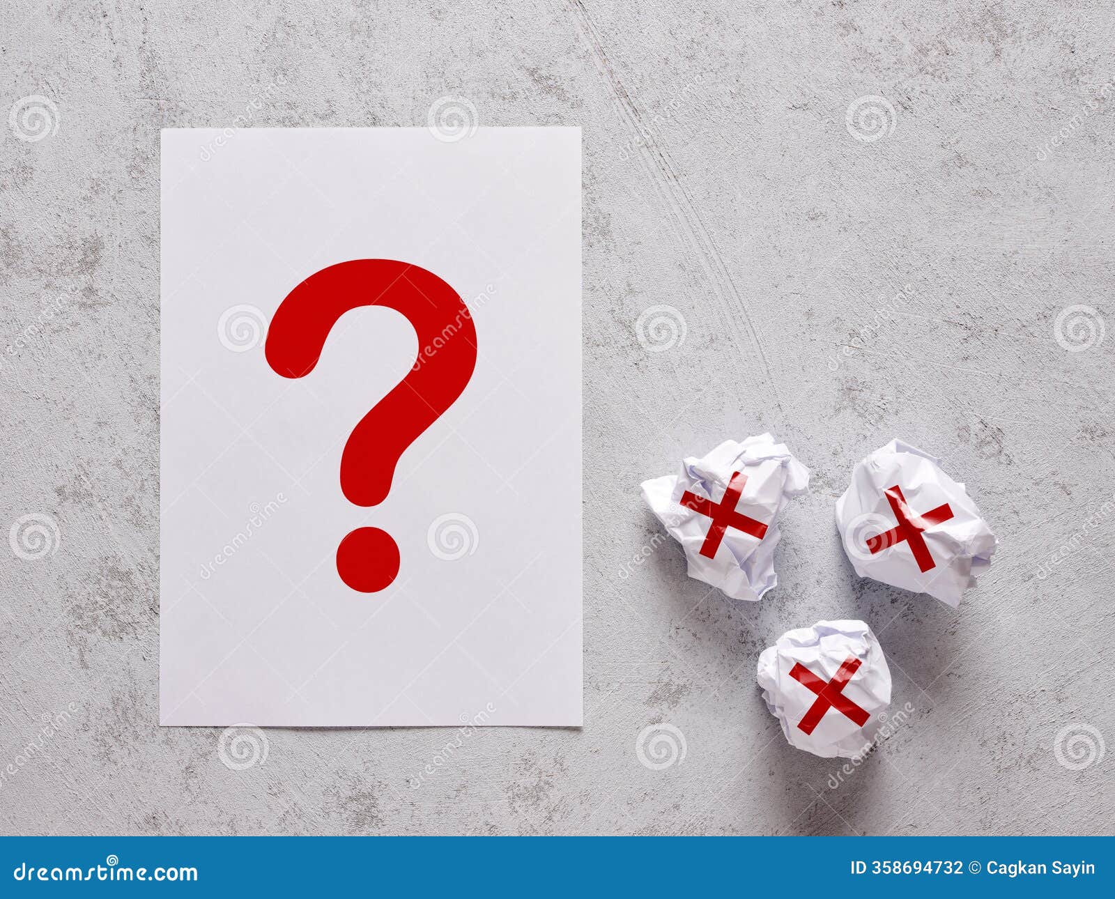 Question Mark Symbol on a White Sheet of Paper Next To the Crumpled ...