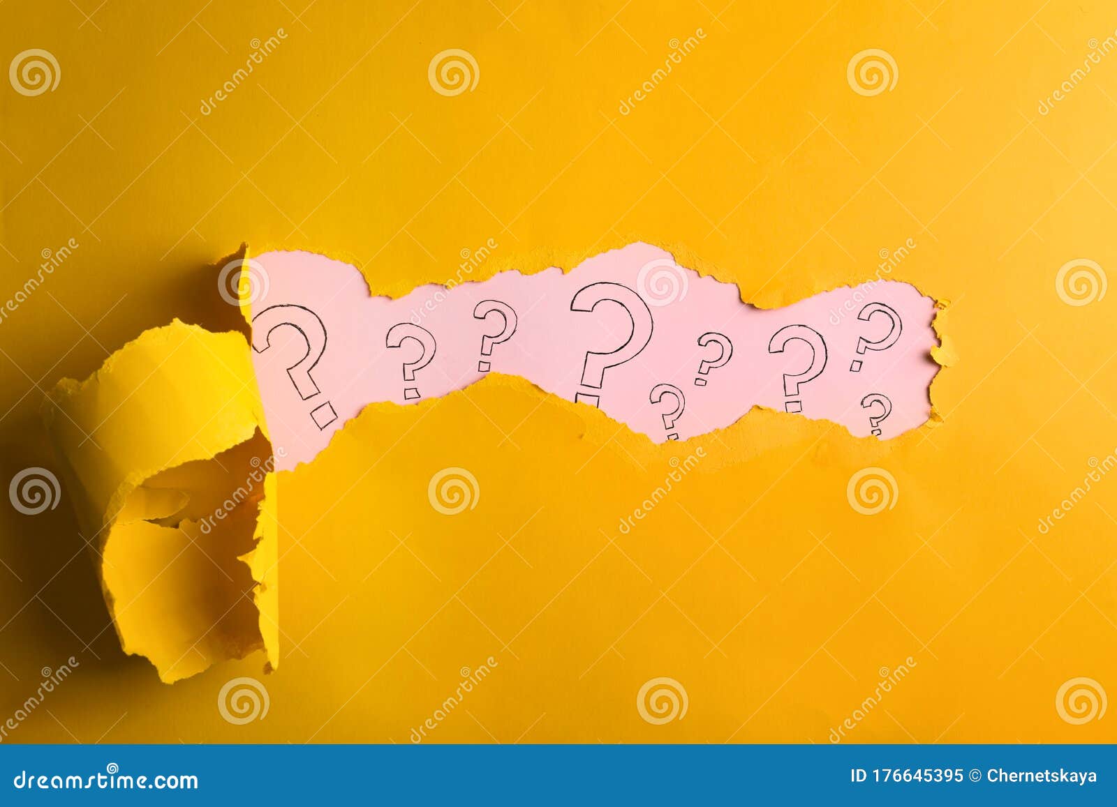 Question Marks on Background, View through Hole in Yellow Paper Stock ...