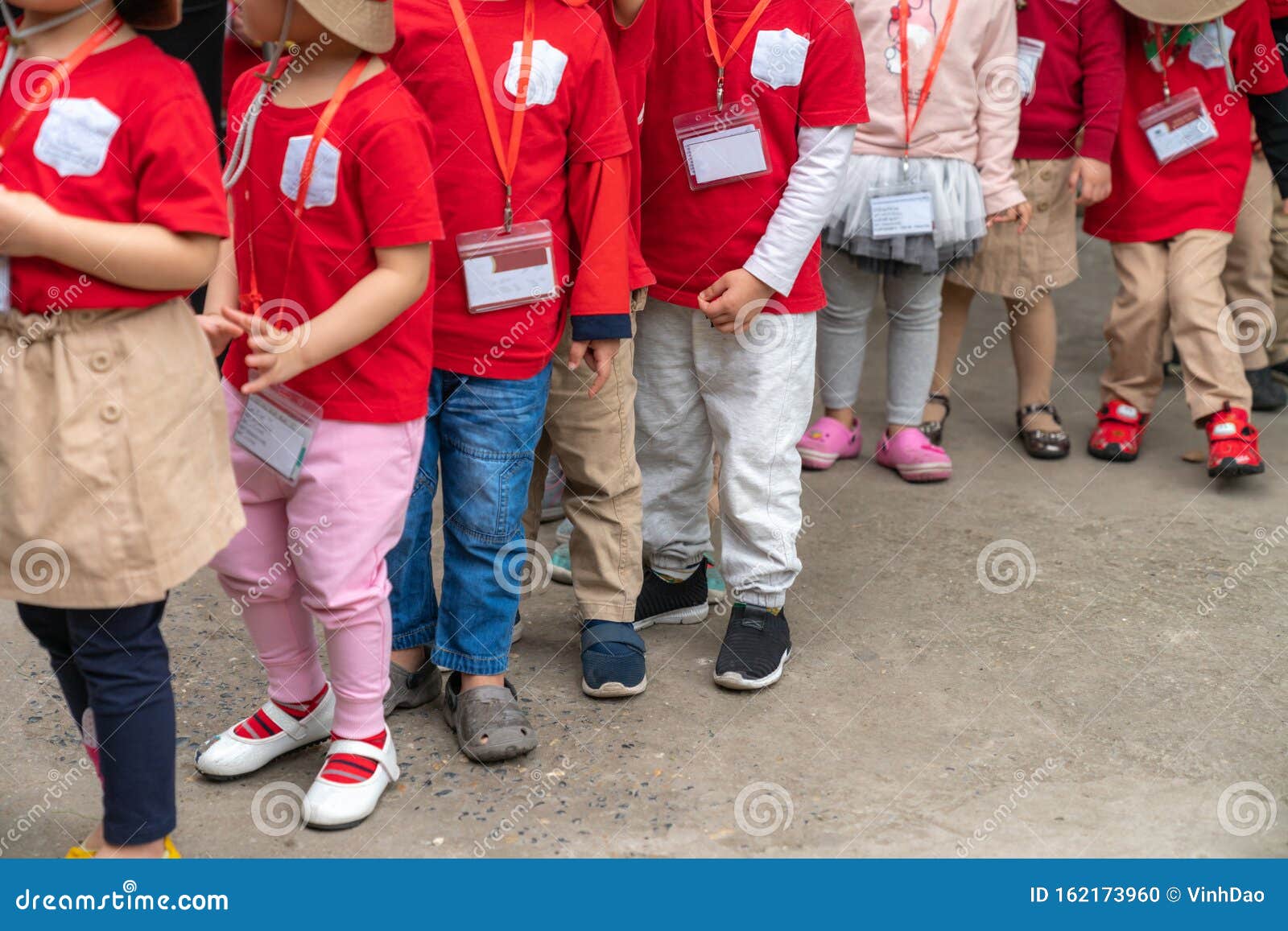 Queue of Asian Kids in School Uniform Standing in Line Stock Photo ...